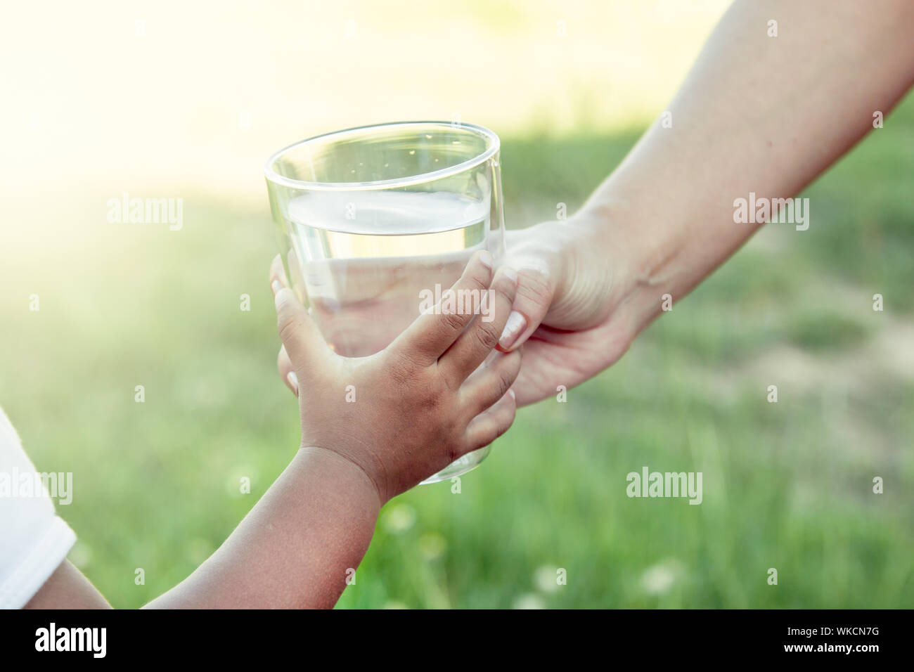 Kids drinking water outdoors hi-res stock photography and images - Alamy