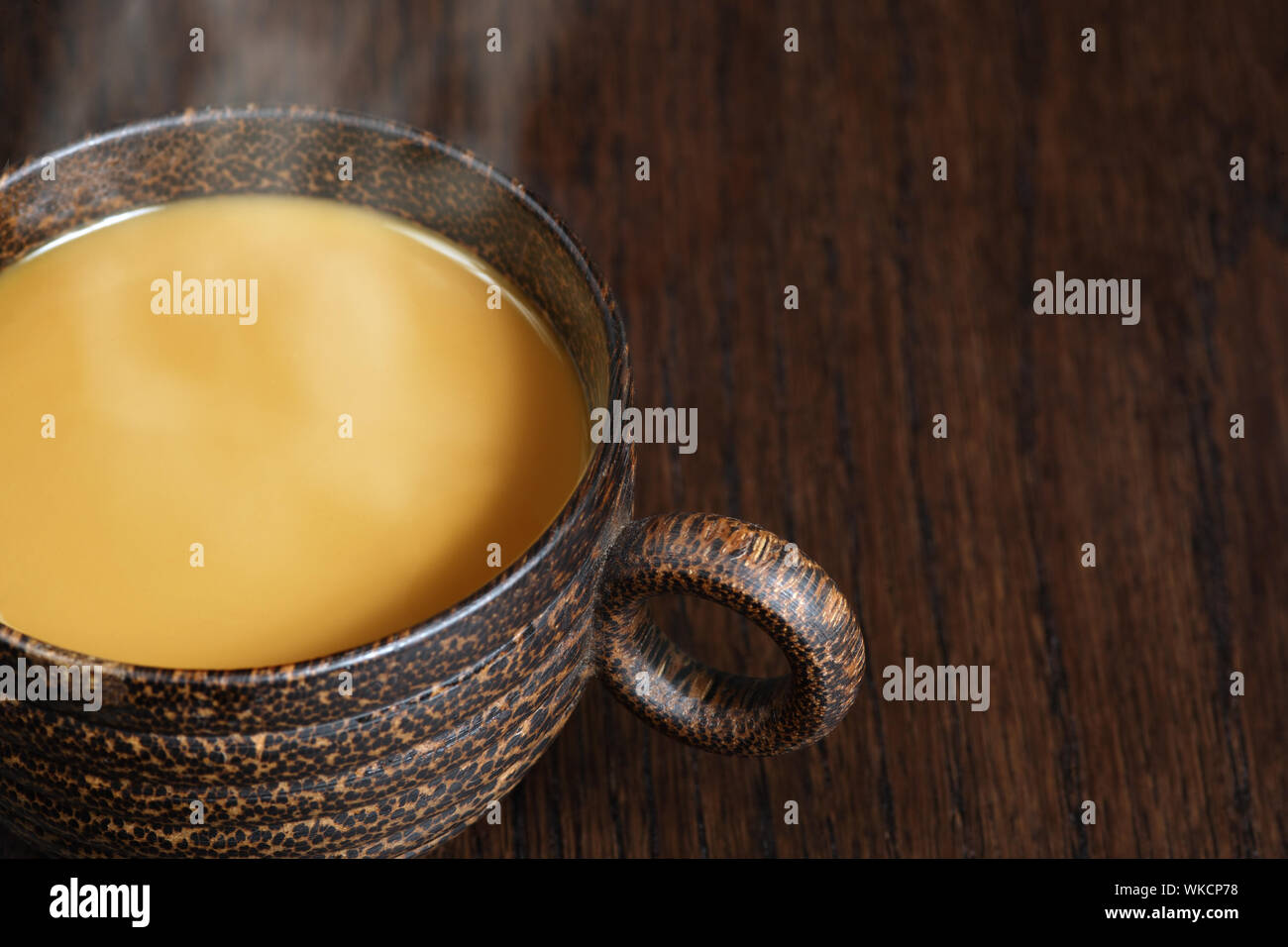Coffee with cream and steam Stock Photo - Alamy