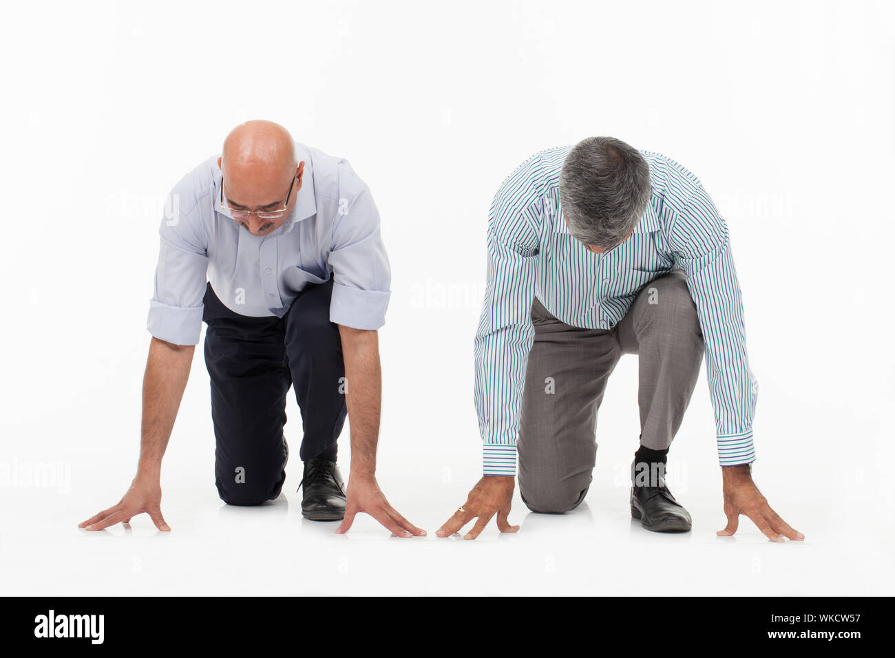 Two businessmen in race at the starting position Stock Photo - Alamy