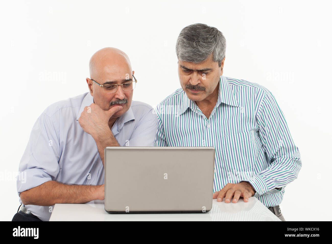 Two man on laptop indian hi-res stock photography and images - Alamy