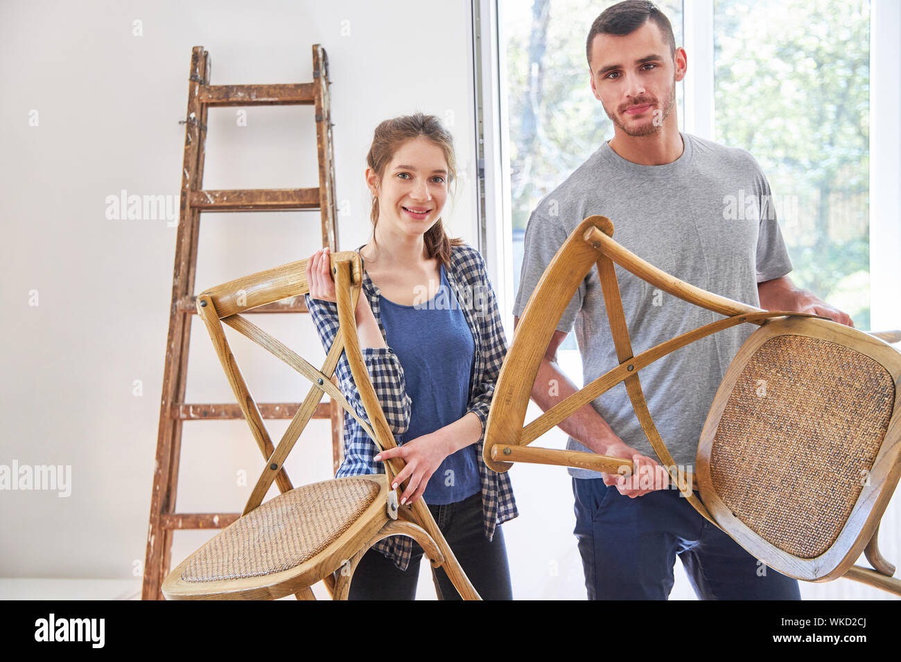 Woman carries furniture in hi-res stock photography and images - Alamy