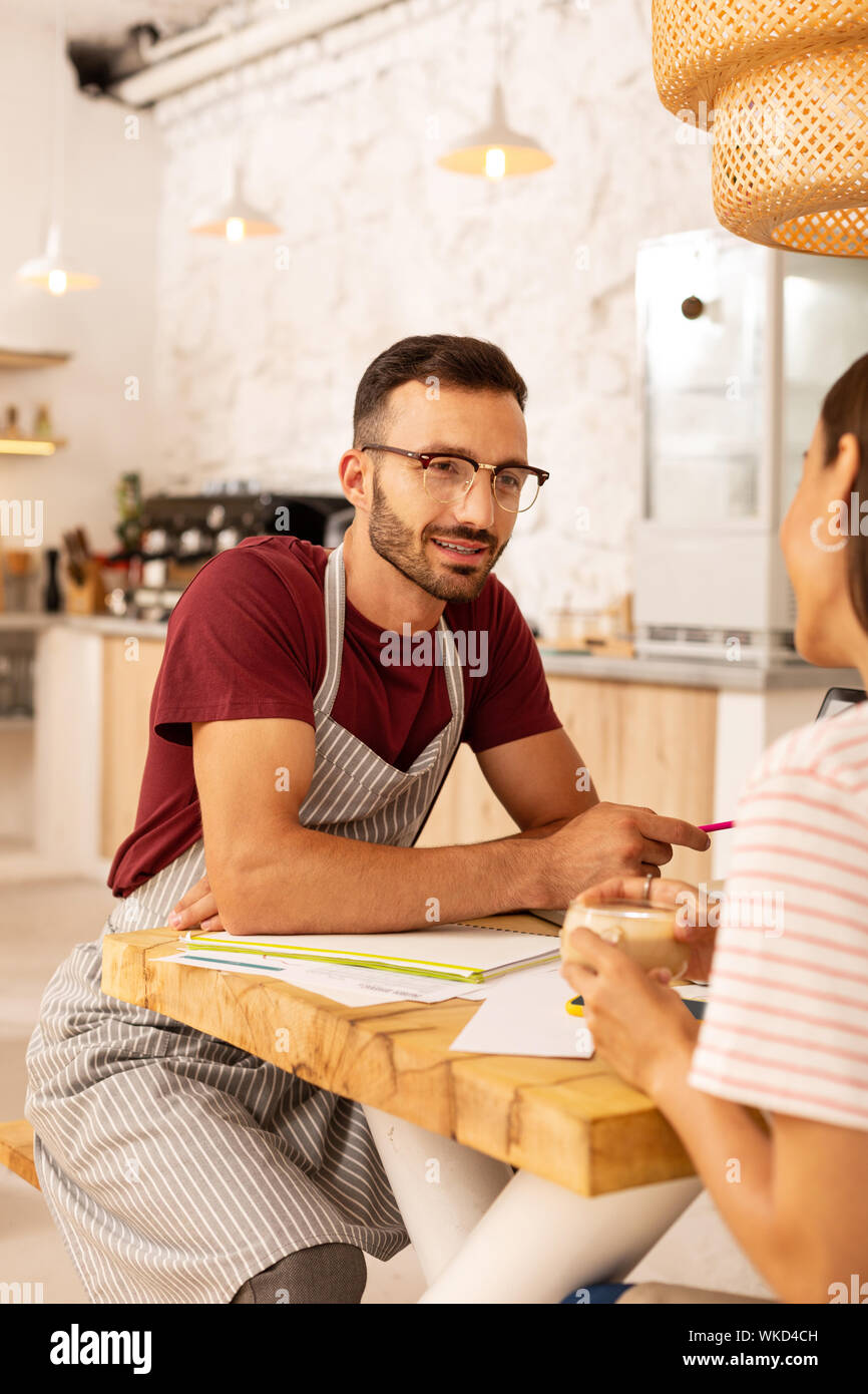 Discussing family business. Husband talking to his wife drinking coffee ...