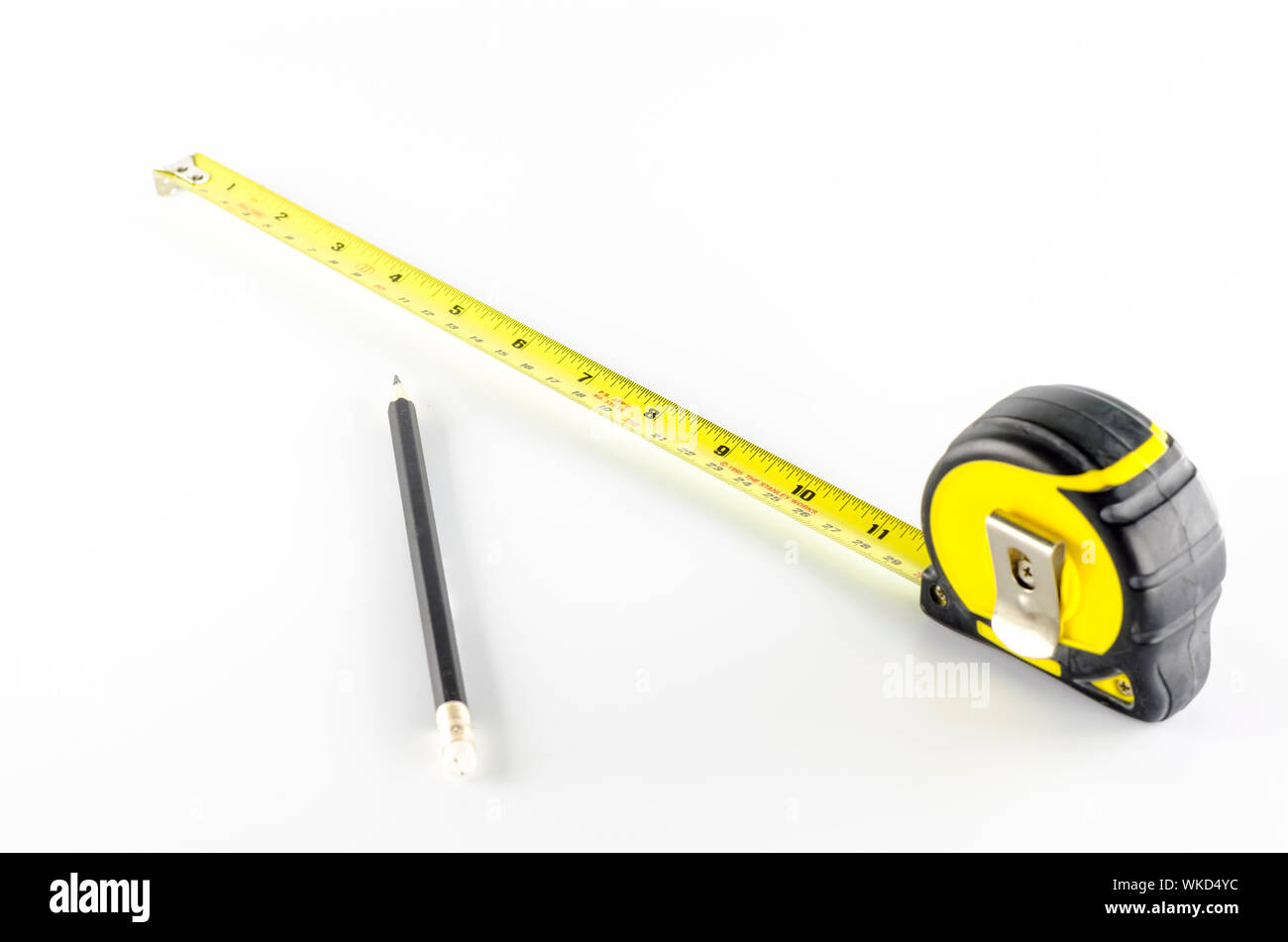 measuring tape with pencil on a white background Stock Photo - Alamy