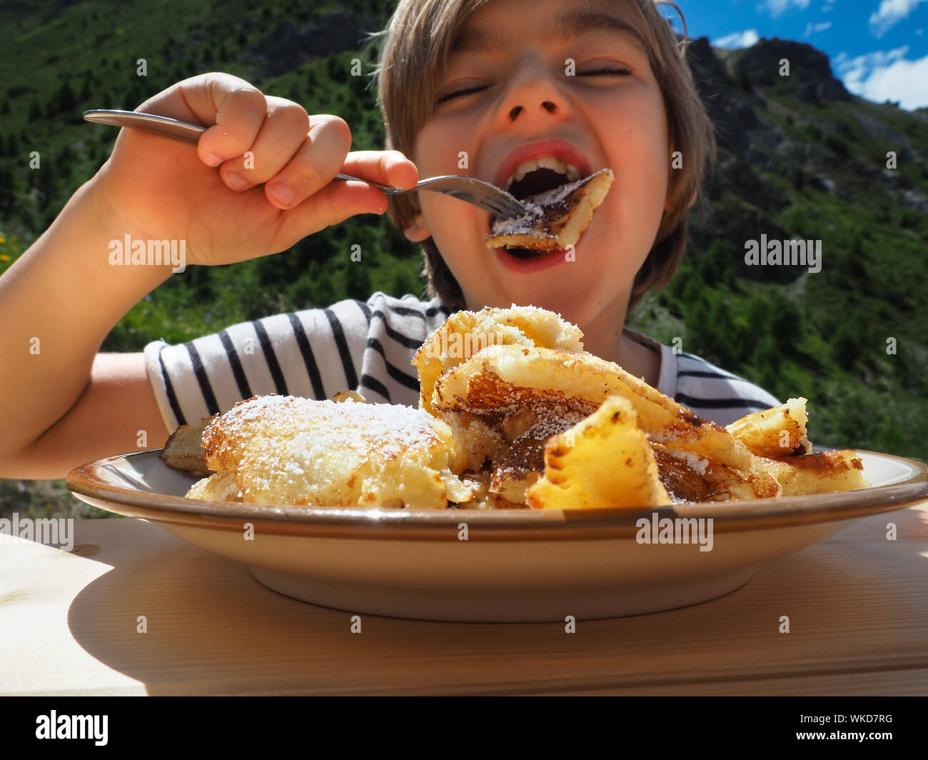 Teenager boy eating ice cream hi-res stock photography and images - Alamy