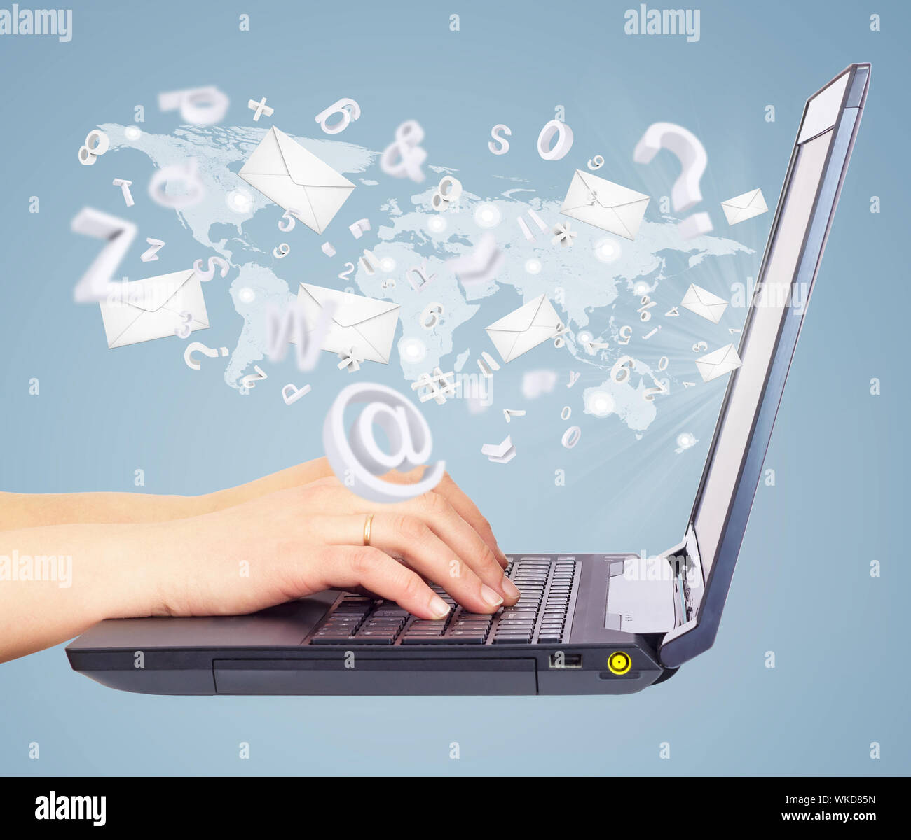 Envelopes and letters are emitted from open laptop. The concept of ...