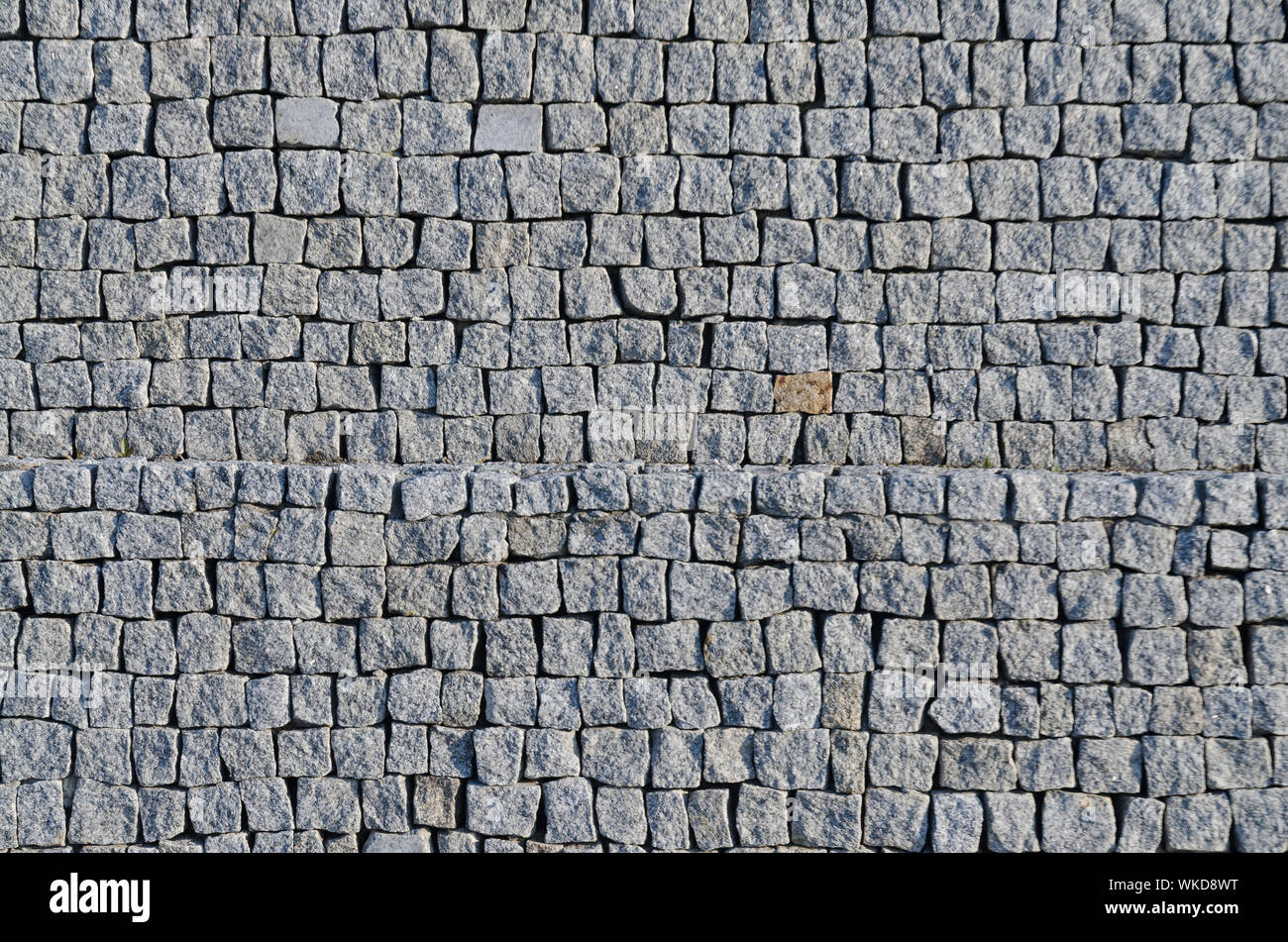 Cobbled pavement pattern made of granite cubes Stock Photo - Alamy