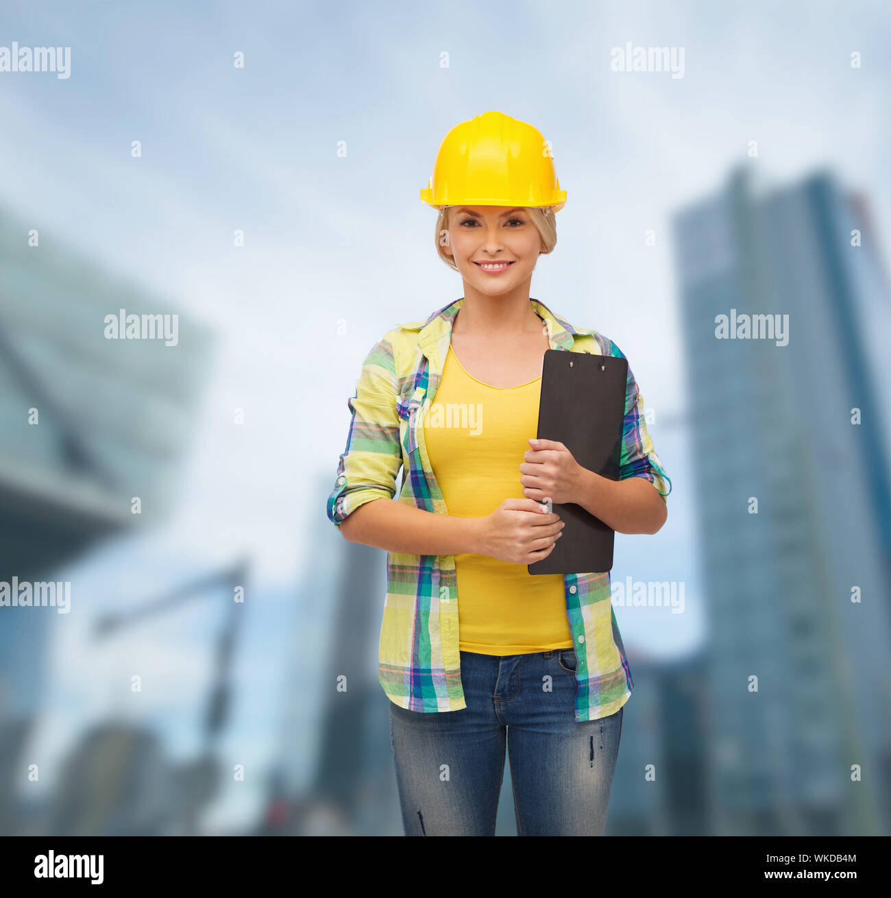 repair, construction and maintenance concept - smiling woman in helmet ...