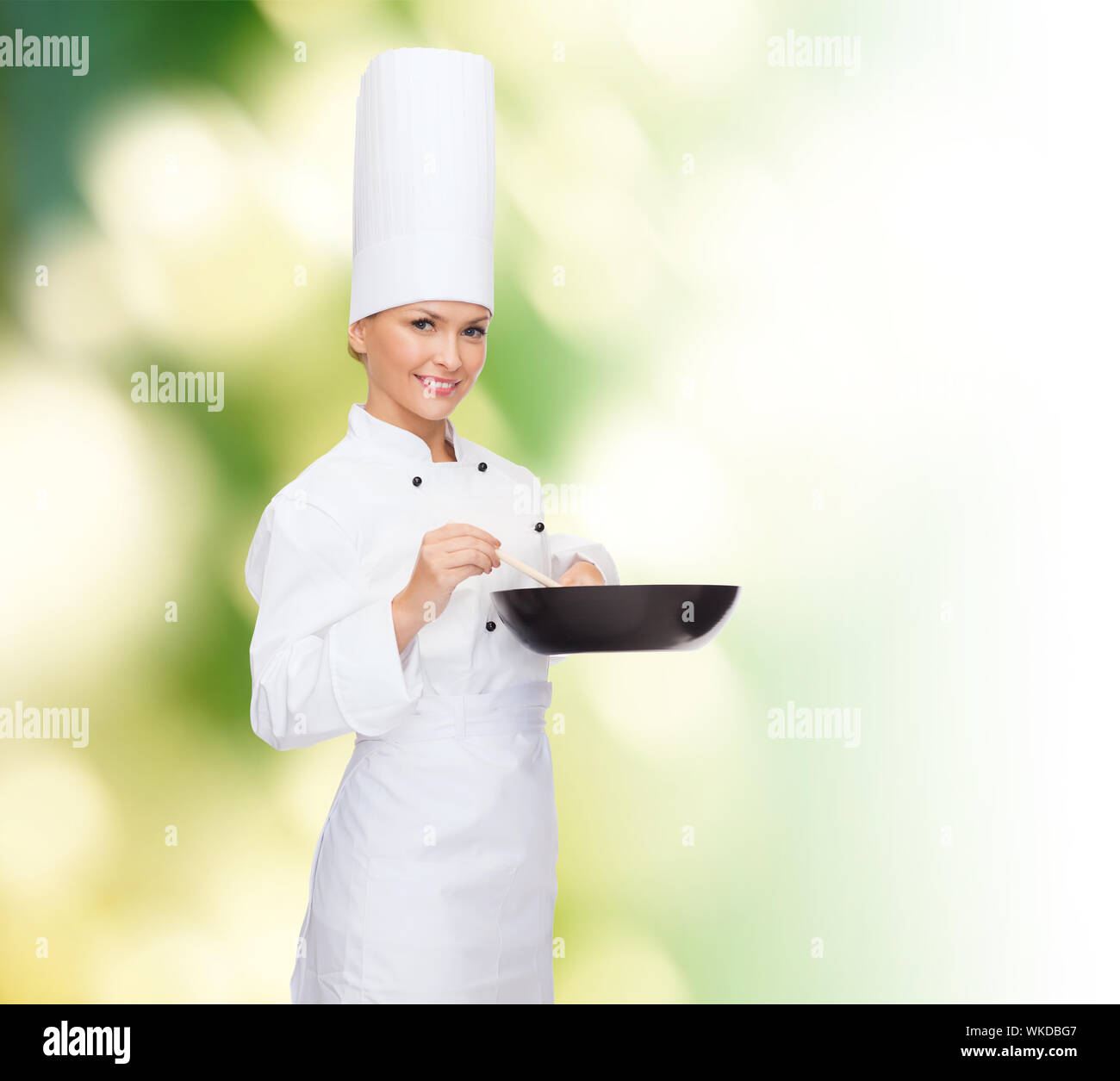 cooking and food concept - smiling female chef with pan and spoon Stock ...
