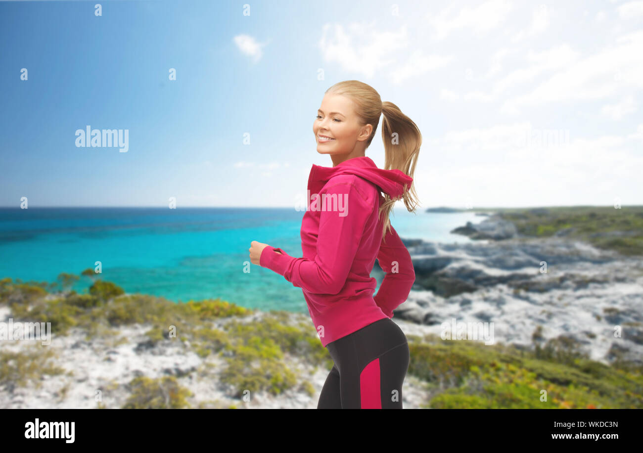 Female runner jumping rocks hi-res stock photography and images - Alamy