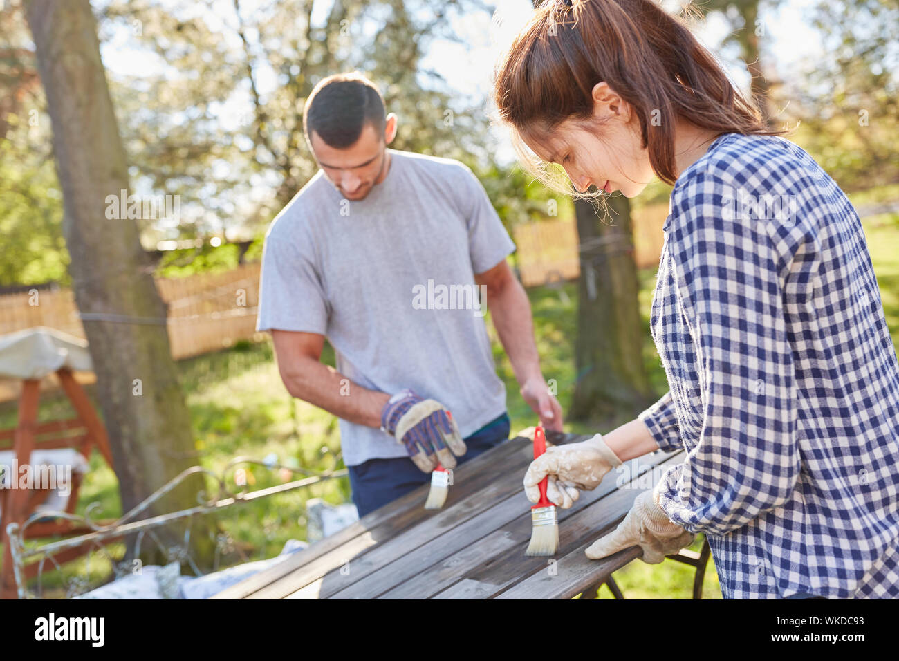 Person coating wood hi-res stock photography and images - Alamy
