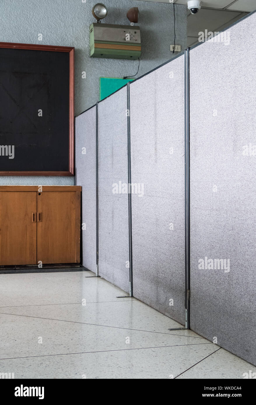 Old partition board is rowing along the pathway of the office for the ...