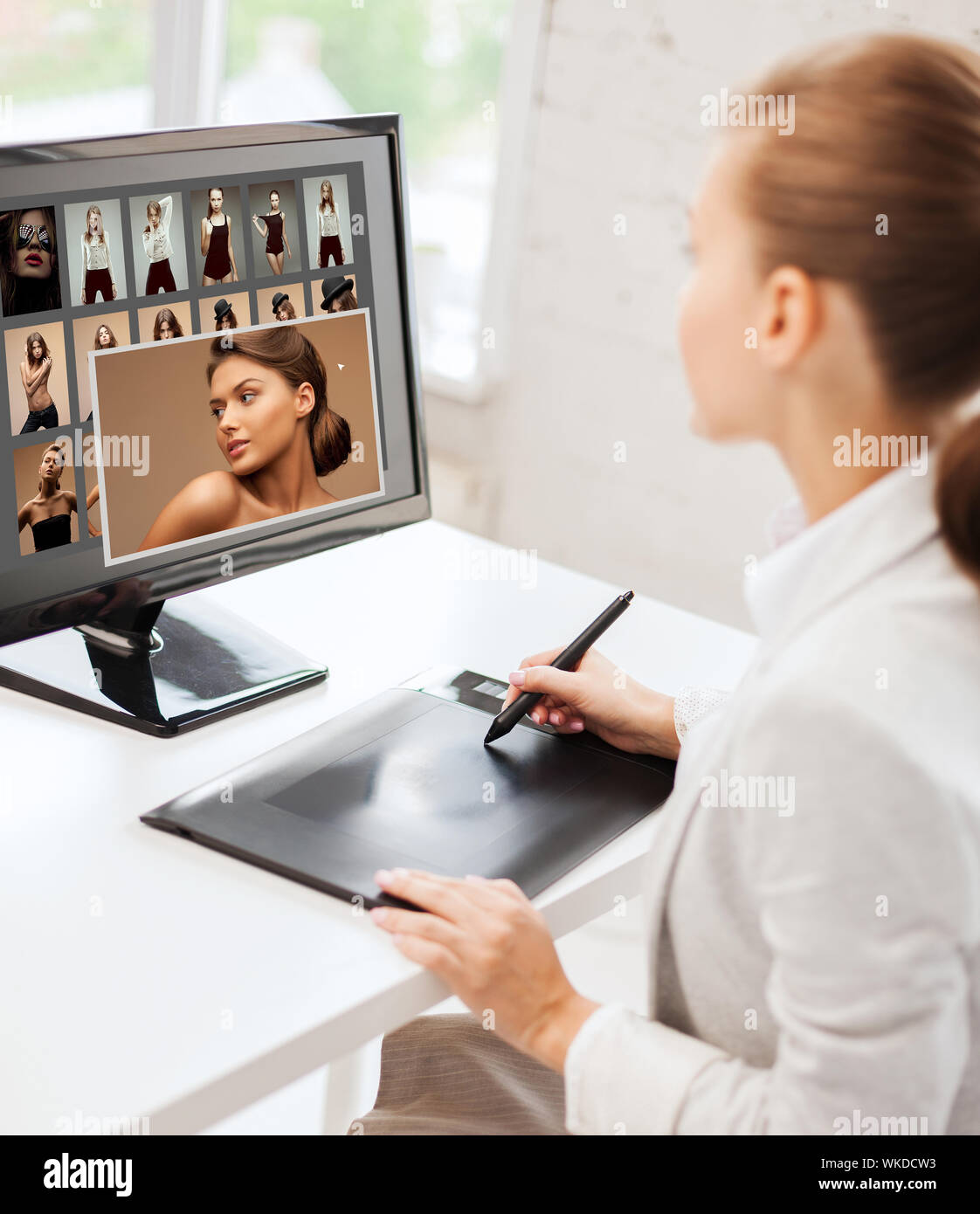 female retoucher working at home or office Stock Photo - Alamy