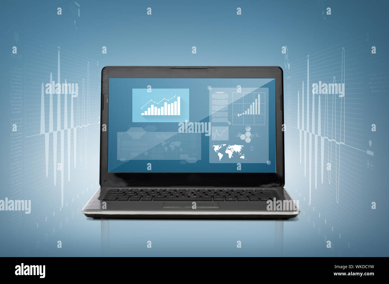 technology and advertisement concept - laptop computer with graph on ...