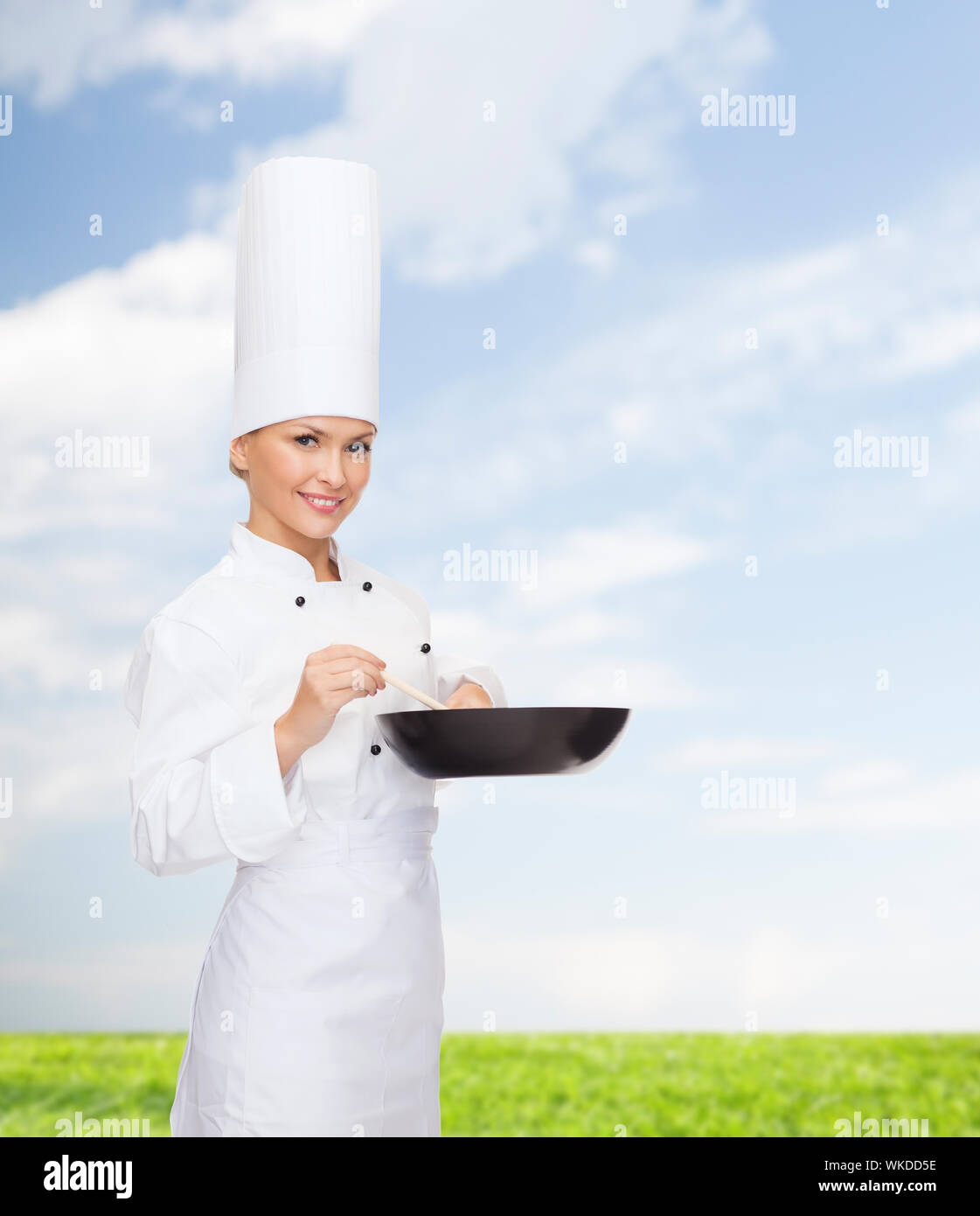 cooking and food concept - smiling female chef with pan and spoon Stock ...