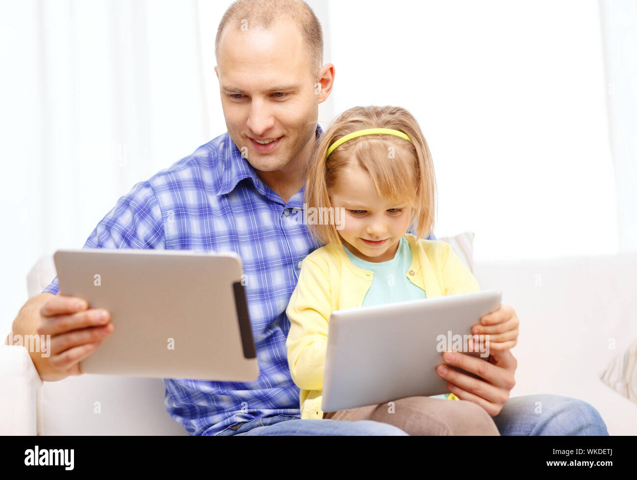 happy father and daughter with tablet pc computer Stock Photo - Alamy