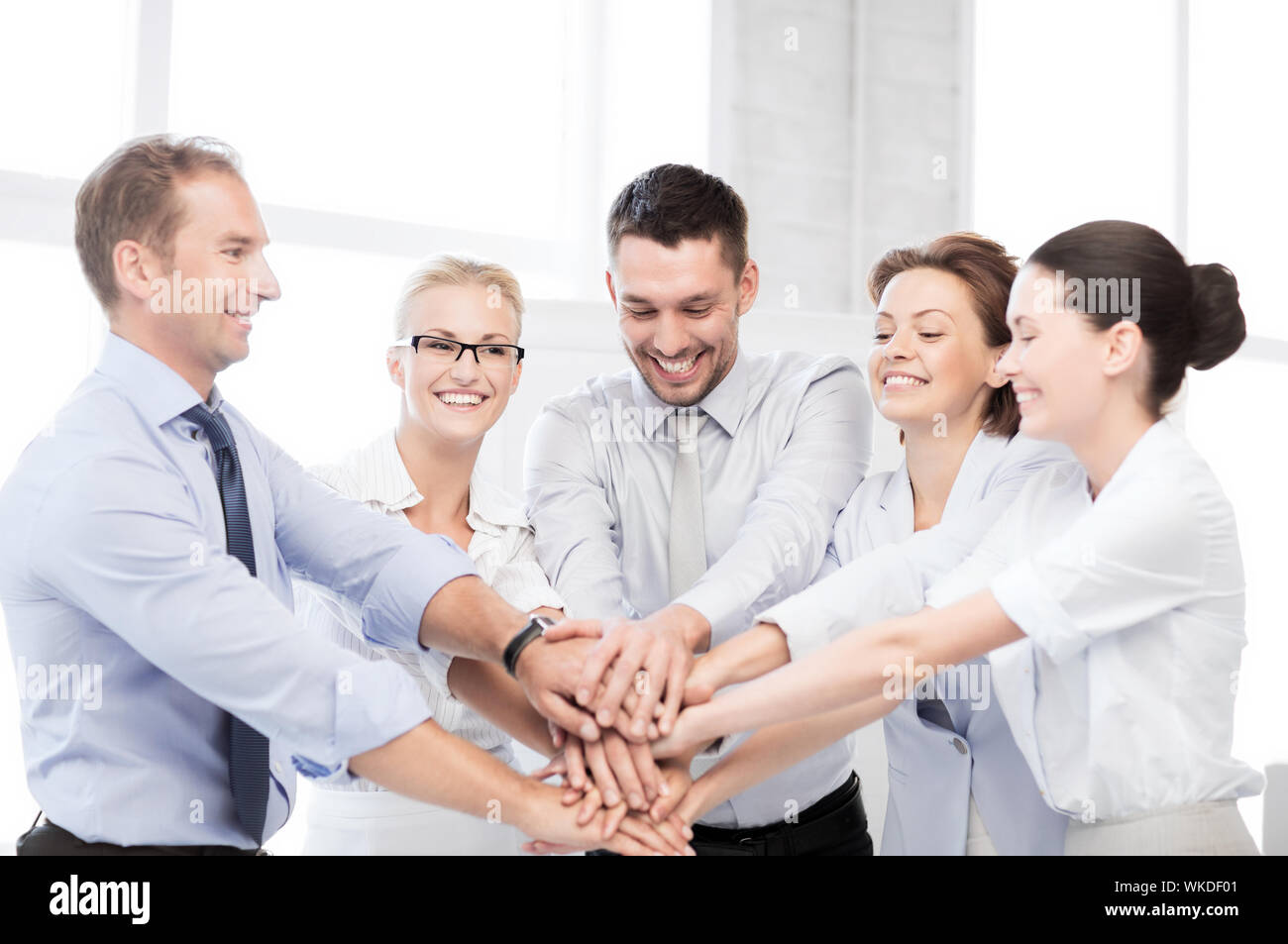 Group cheerful coworkers celebrating hi-res stock photography and ...