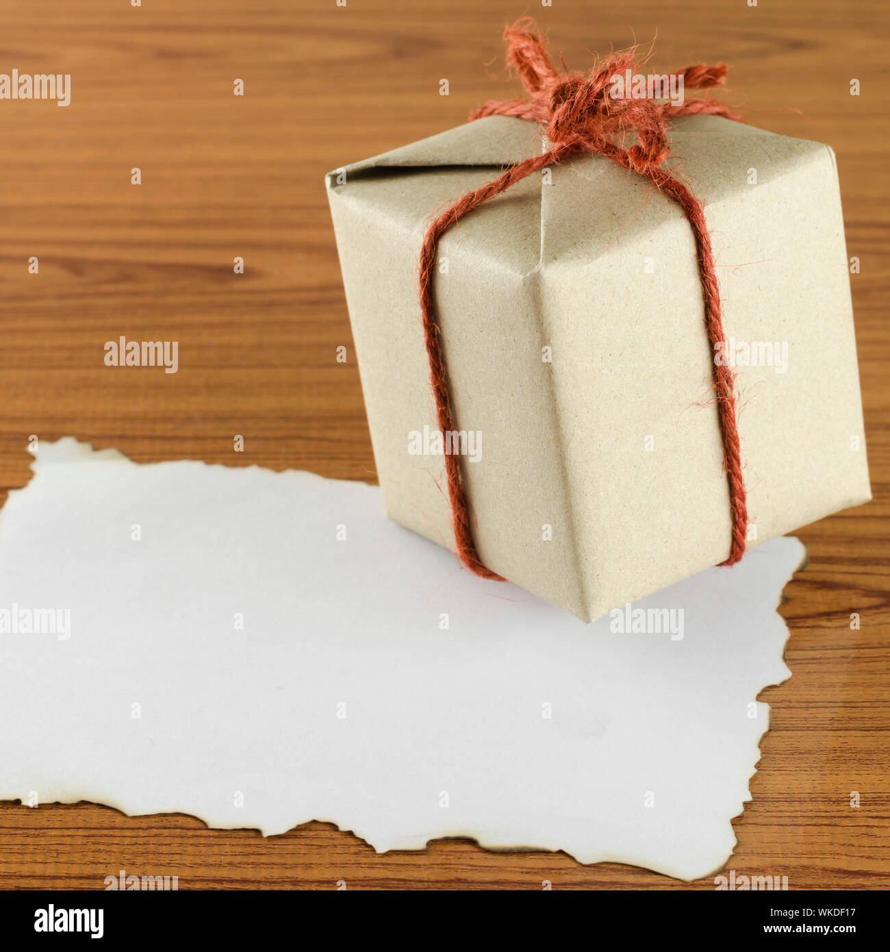 gift box with paper write your note on wood background Stock Photo - Alamy