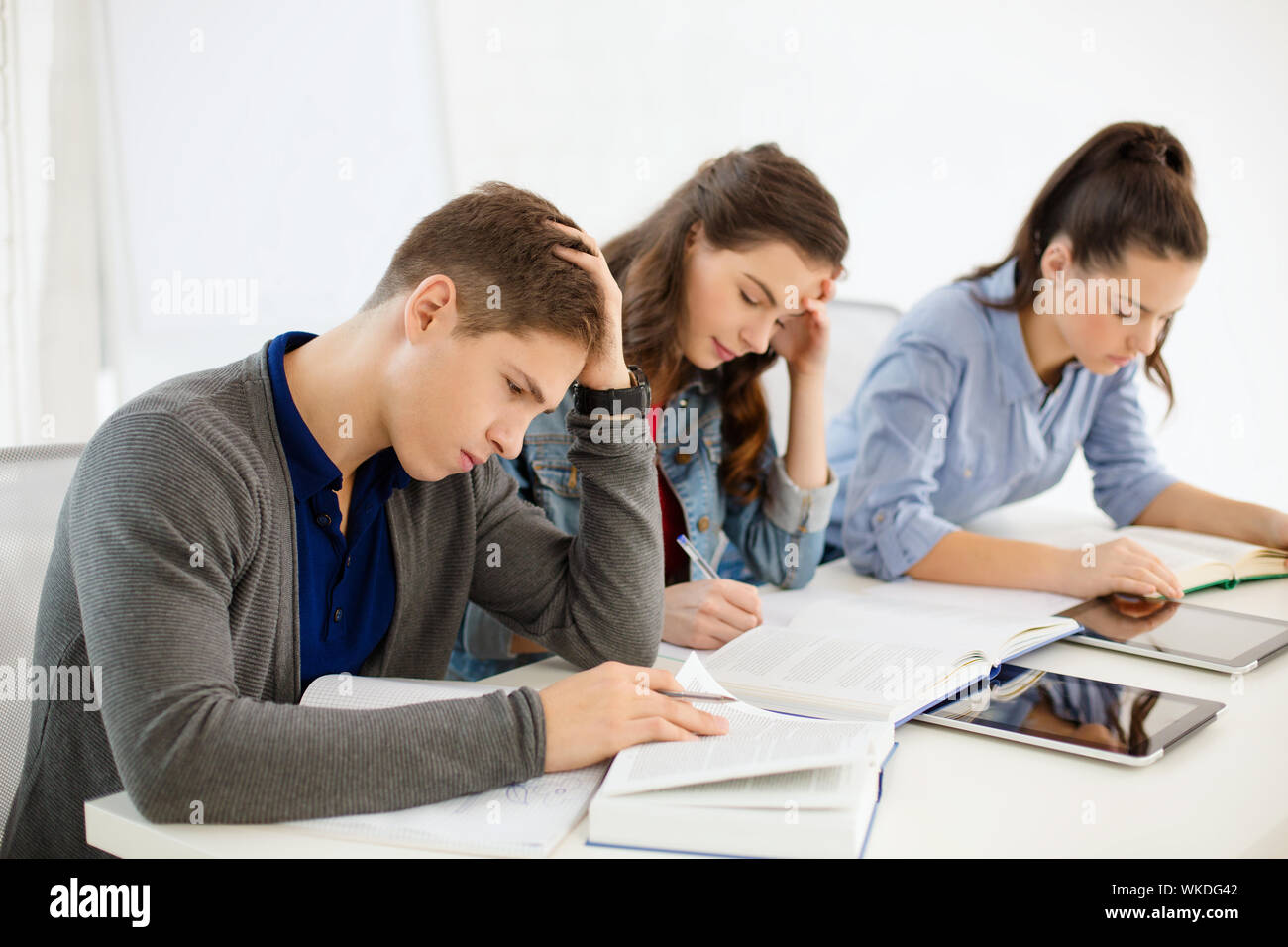 students with notebooks and tablet pc at school Stock Photo - Alamy