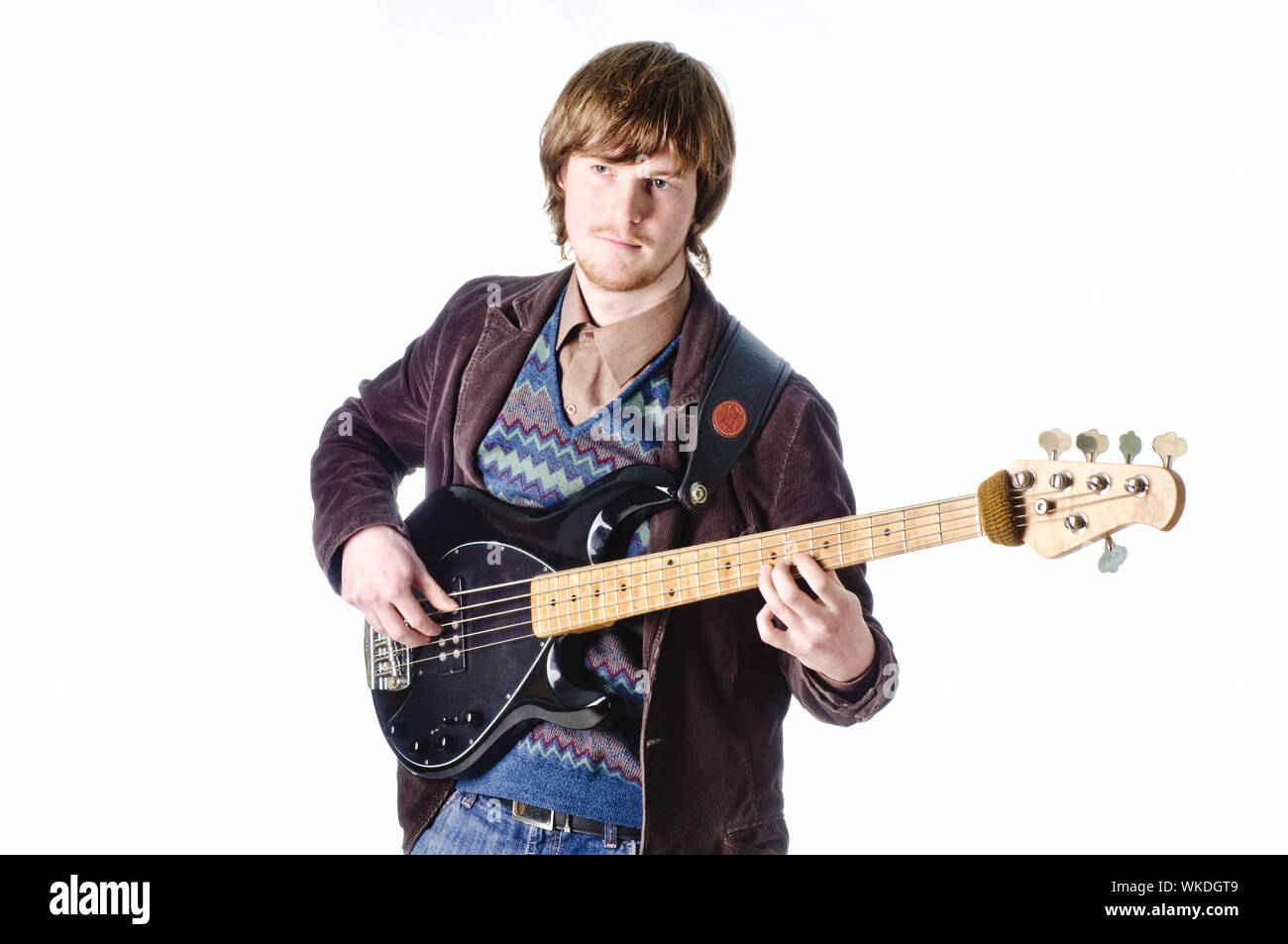 Rocker with his classic electric bass guitar Stock Photo - Alamy