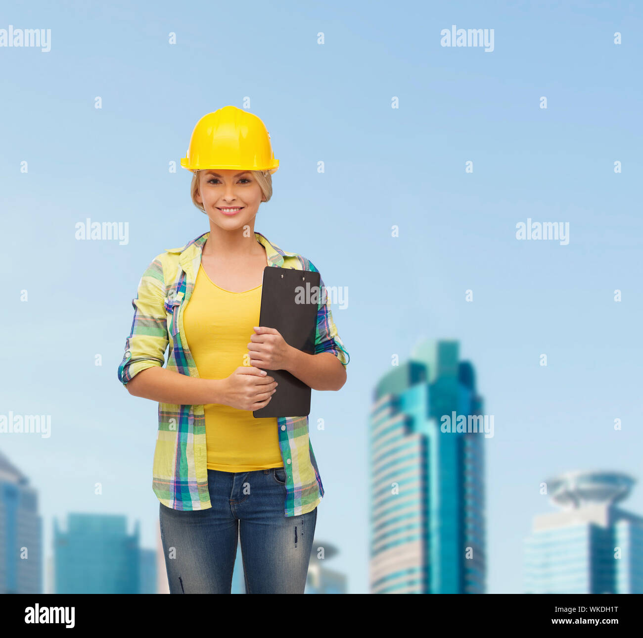 repair, construction and maintenance concept - smiling woman in helmet ...