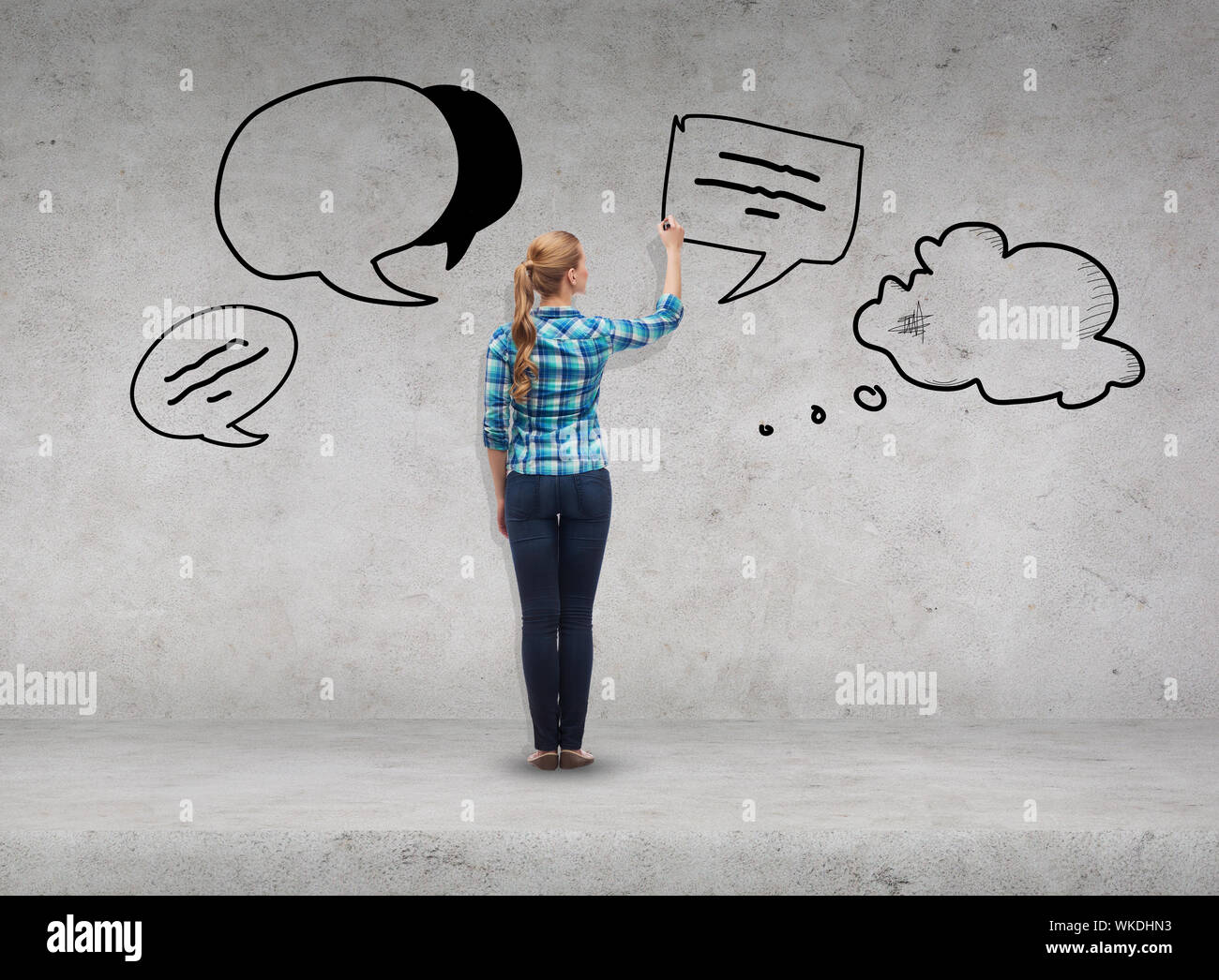 happiness and people concept - smiling young woman writing or drawing ...