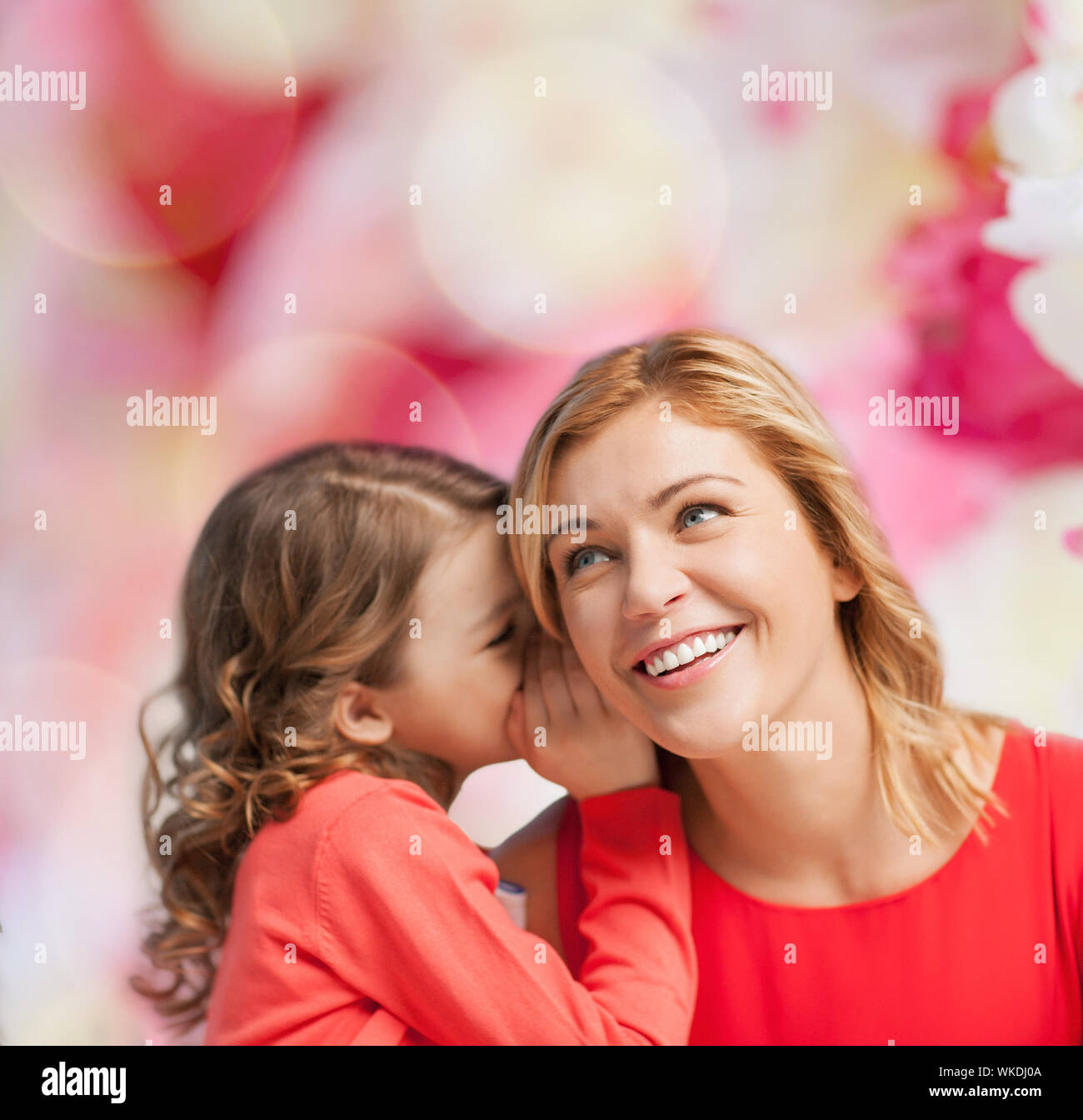 family, child and happiness concept - smiling mother and daughter ...