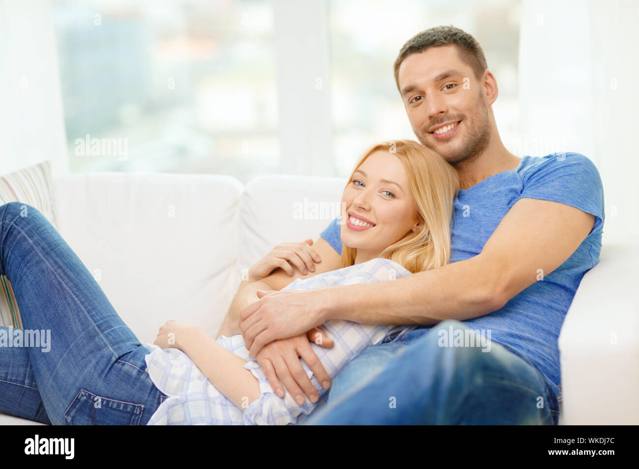 smiling happy couple at home Stock Photo - Alamy