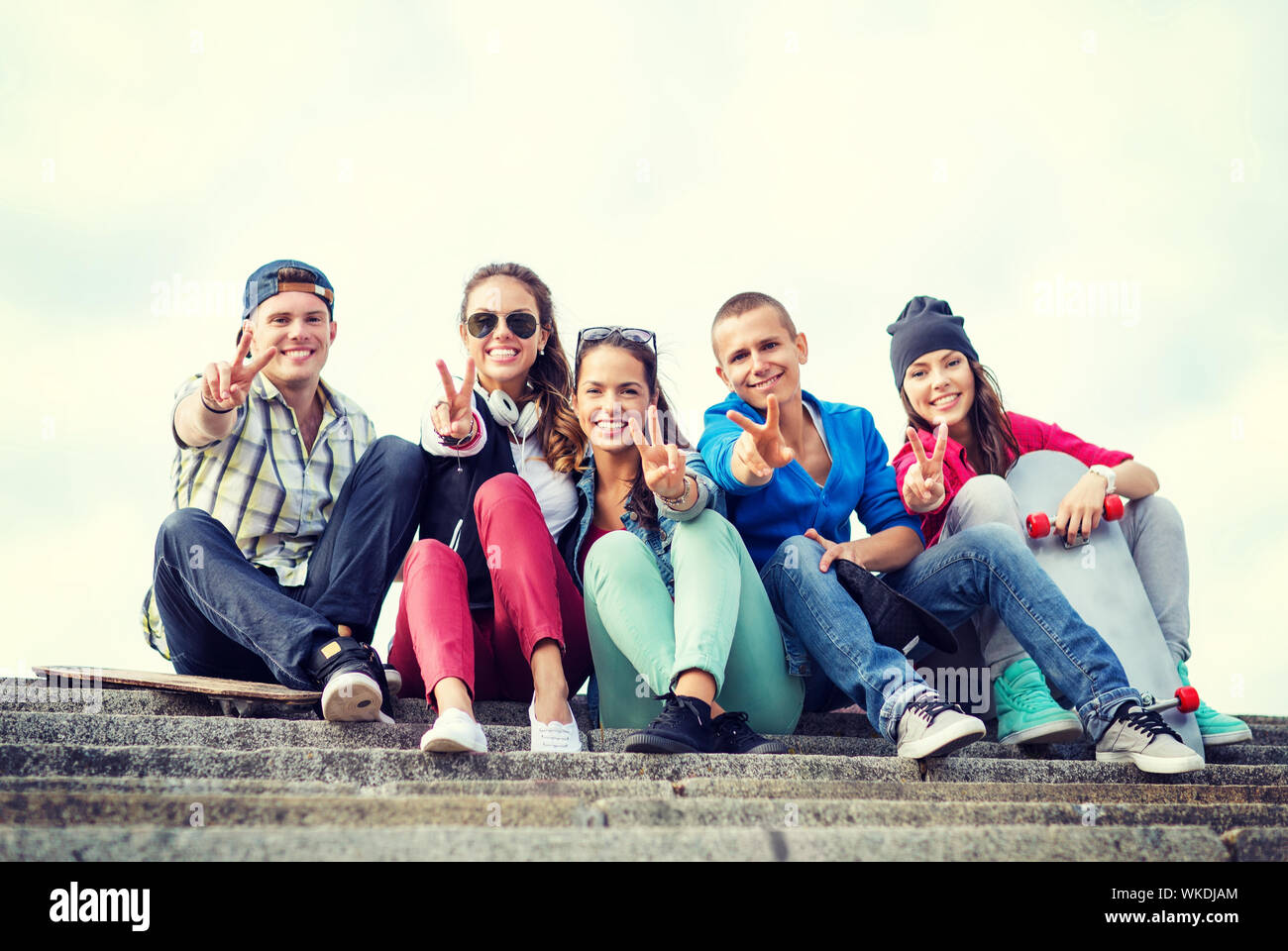 group of teenagers showing finger five Stock Photo - Alamy