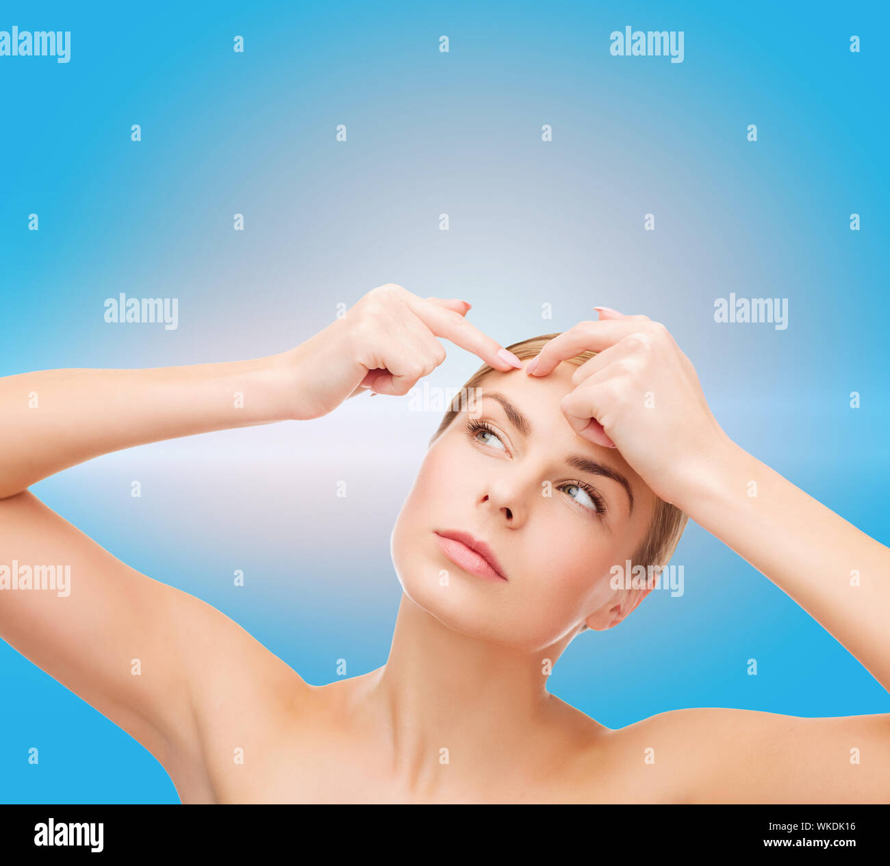 Squeezing spots hi-res stock photography and images - Alamy