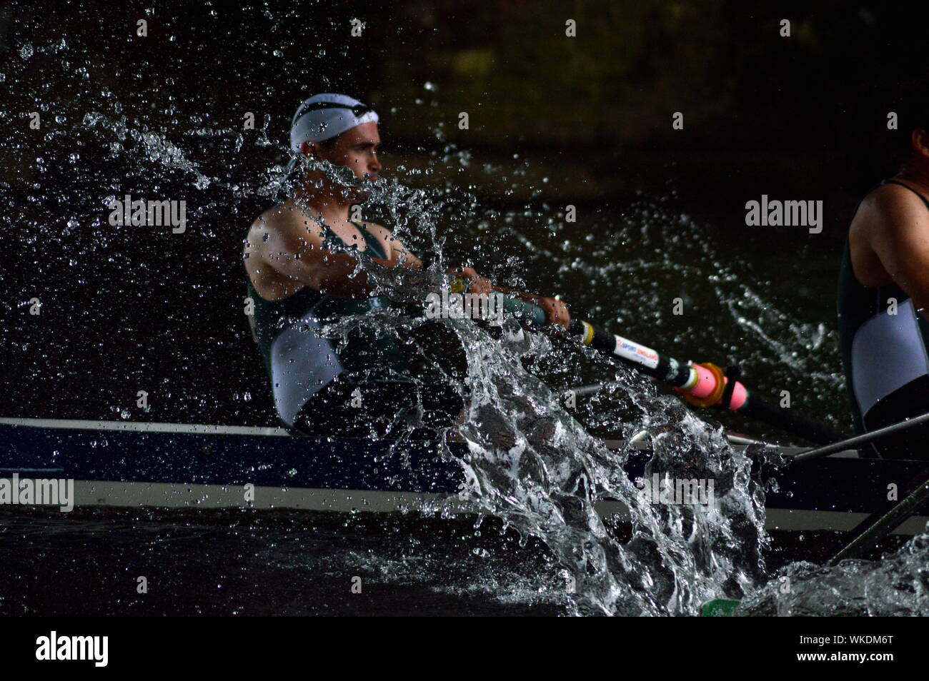 Young men rowing boat hi-res stock photography and images - Alamy