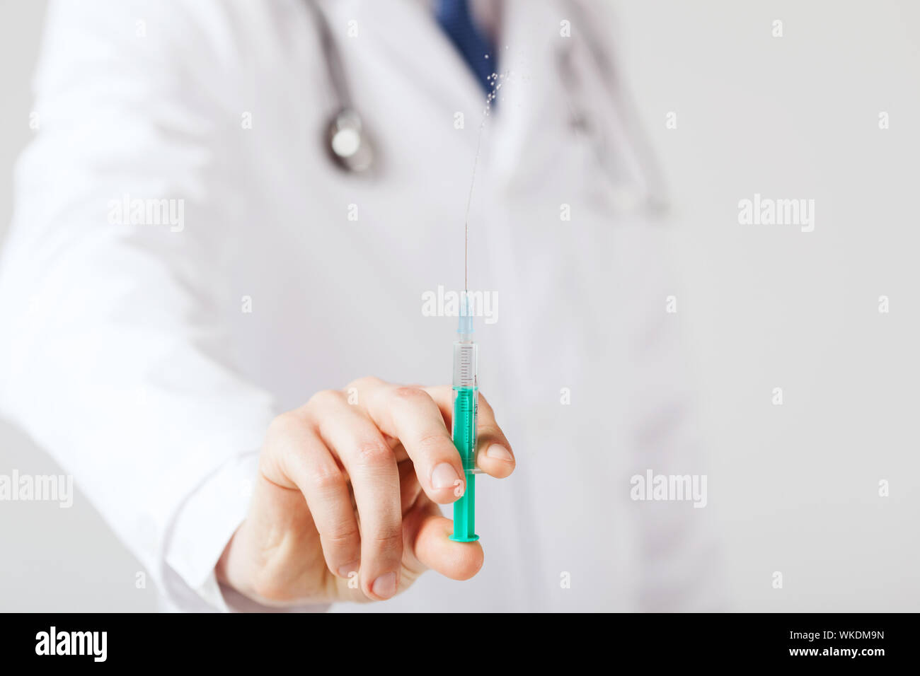 healthcare and medicine concept - close up of male hand holding syringe ...
