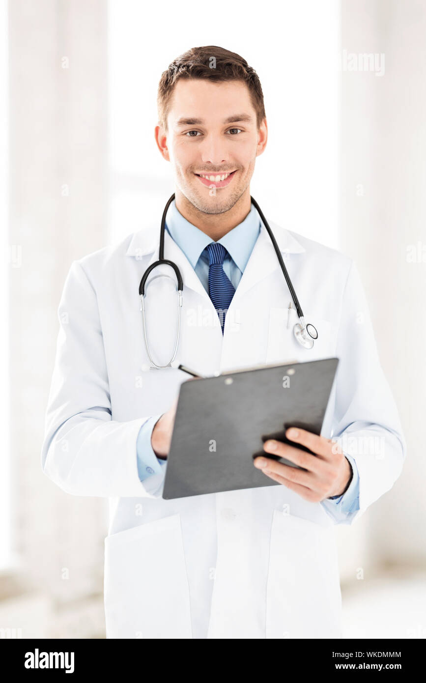 bright picture of male doctor writing prescription Stock Photo - Alamy