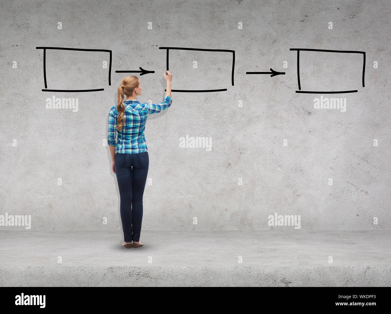 happiness and people concept - smiling young woman writing or drawing ...