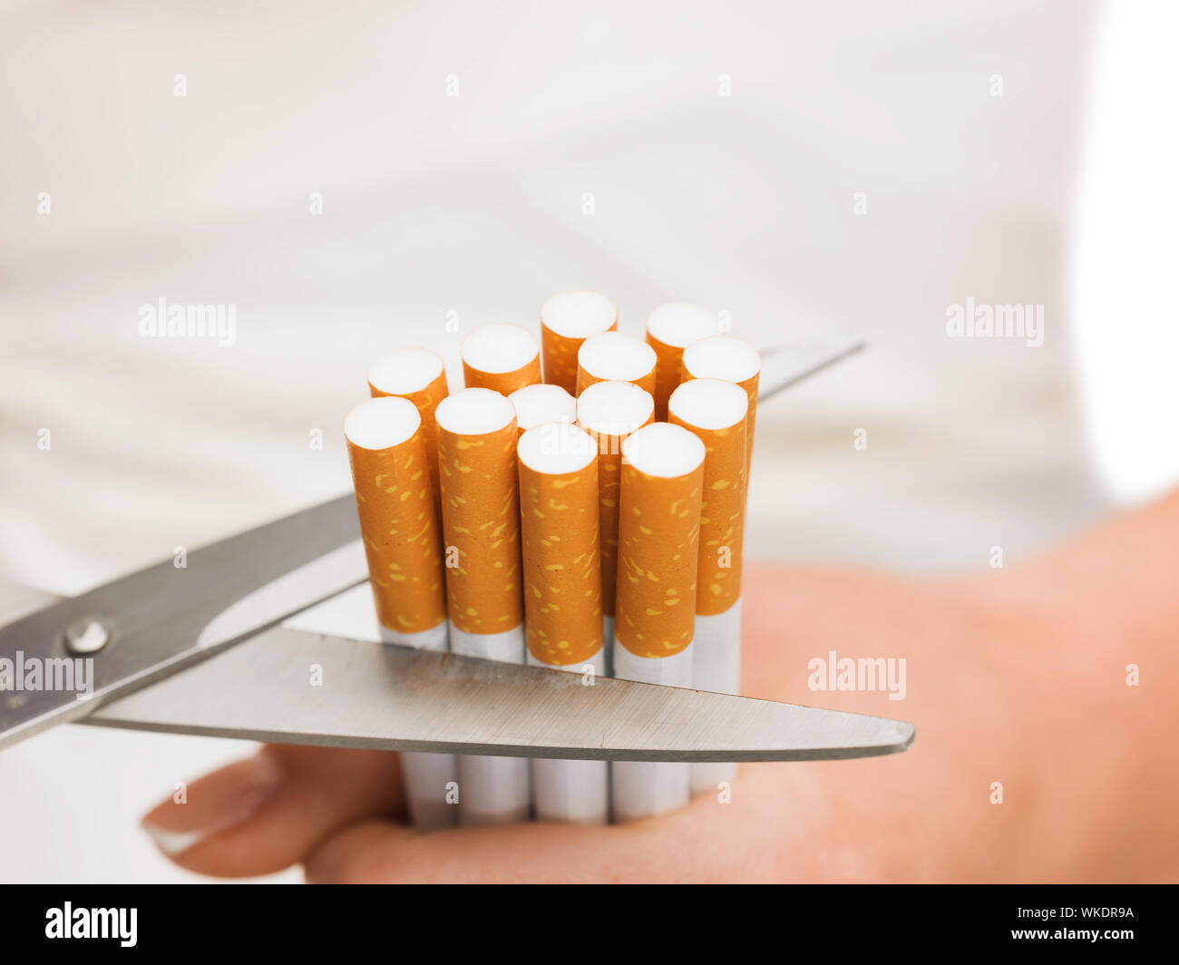 close up of scissors cutting many cigarettes Stock Photo - Alamy