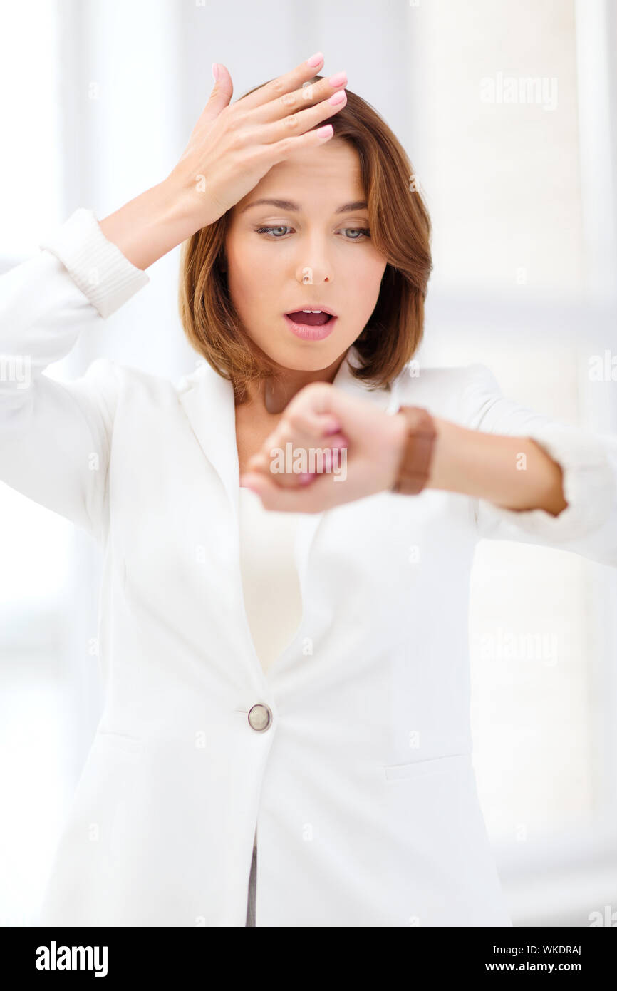 Stressed worker looking at watch hi-res stock photography and images ...