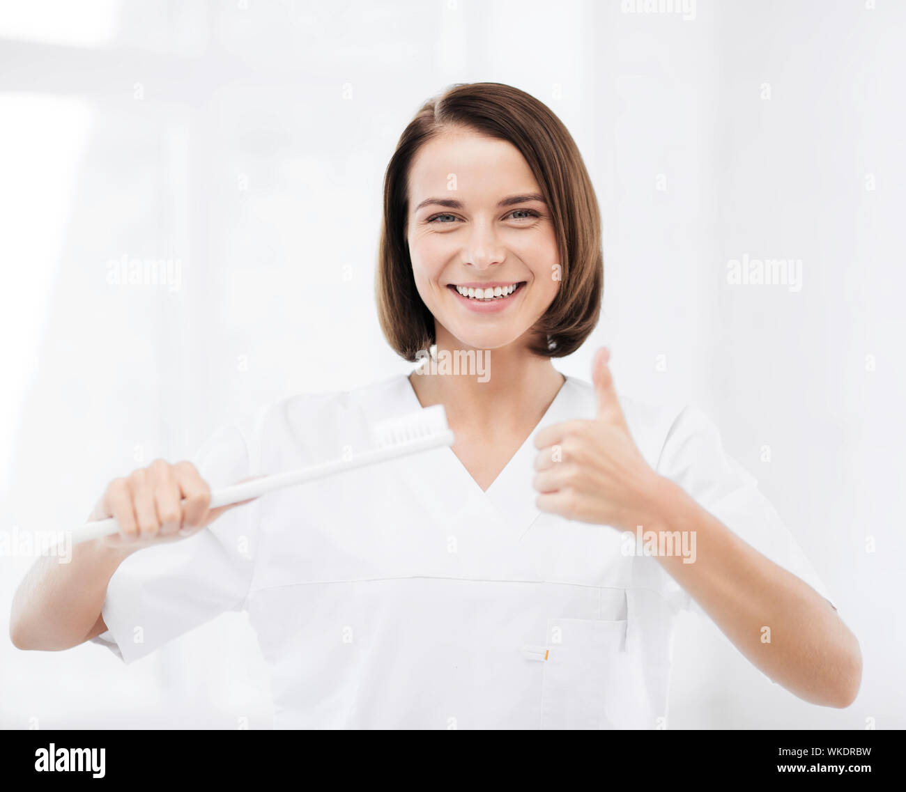dentist with toothbrush in hospital Stock Photo - Alamy