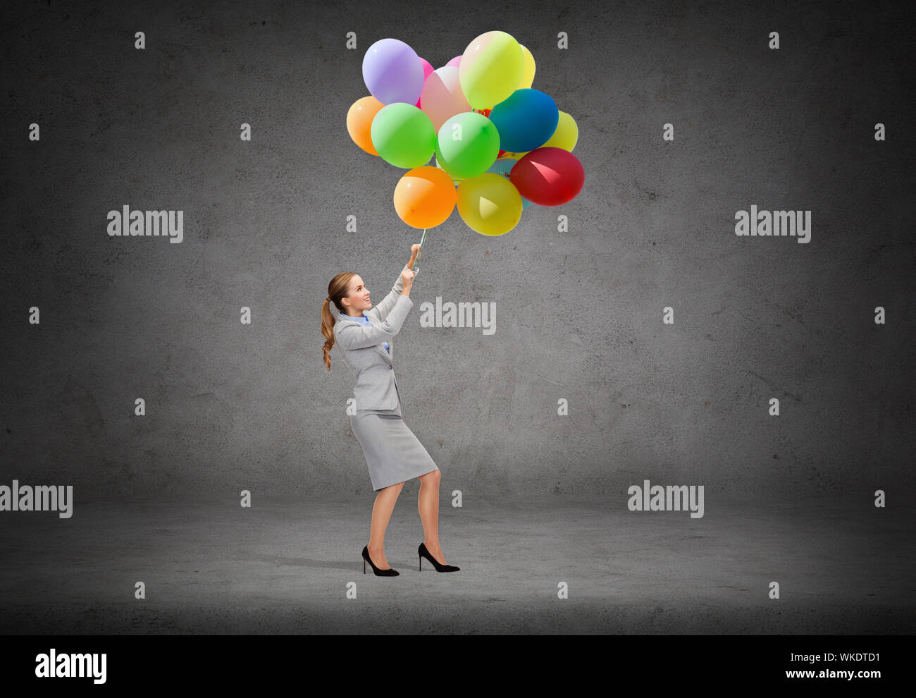 business and education concept - smiling businesswoman pulling down ...