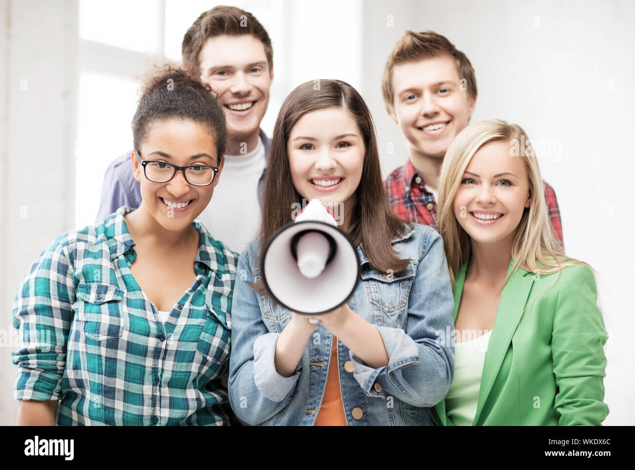 group of students with megaphone at school Stock Photo - Alamy