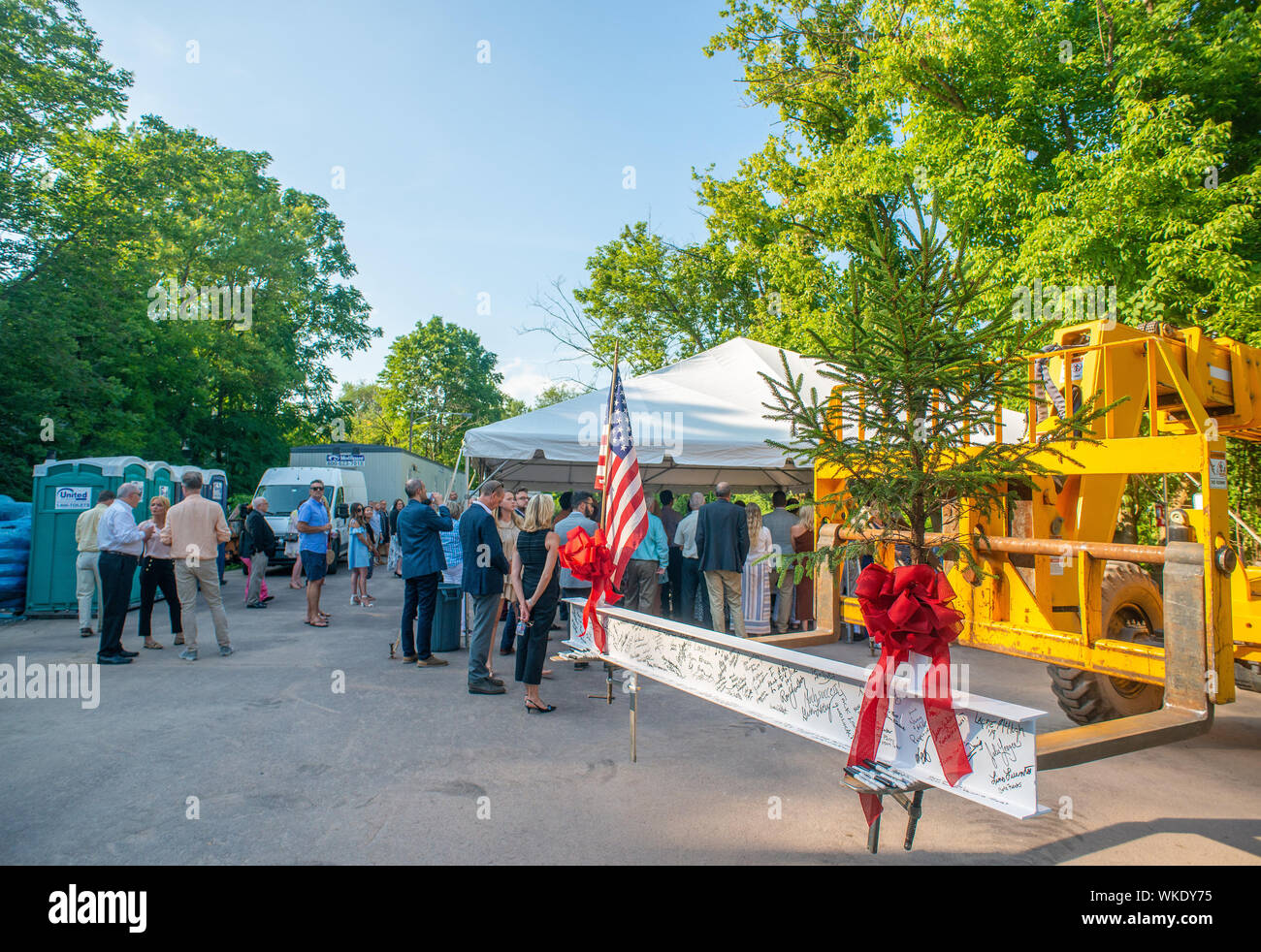 The signed steel beam awaits placement during the "Topping Off ...