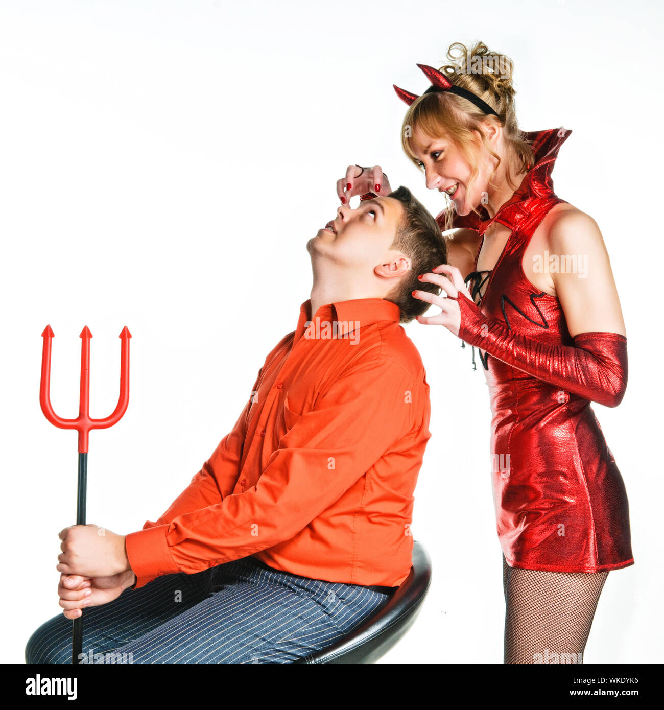 Red devil couple on white background Stock Photo - Alamy