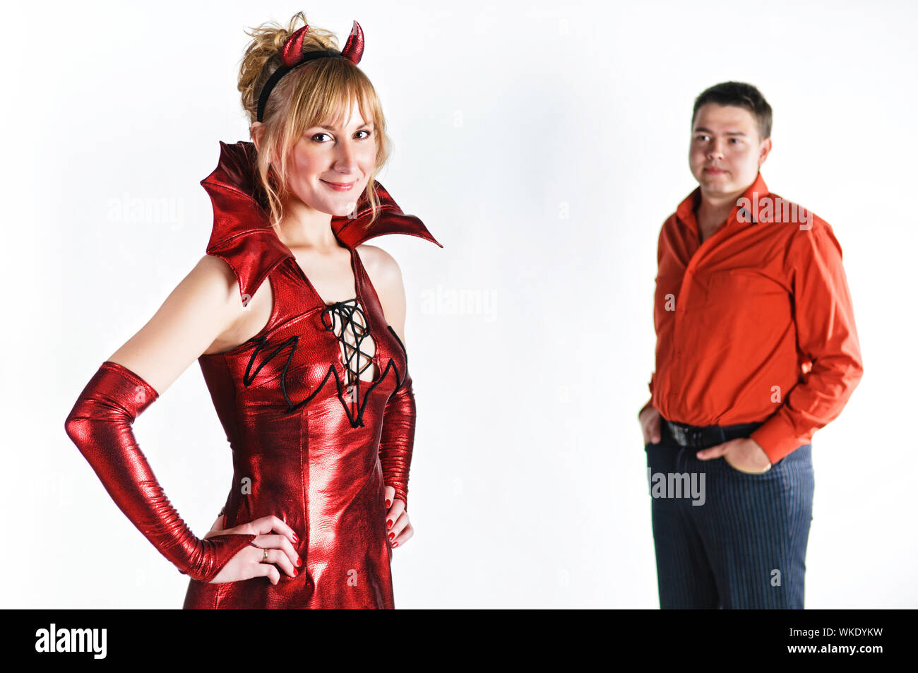Red devil couple on white background Stock Photo - Alamy