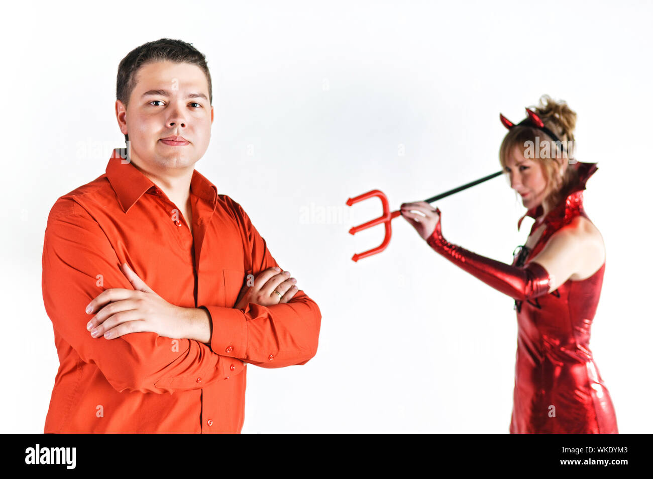 Red devil couple on white background Stock Photo - Alamy
