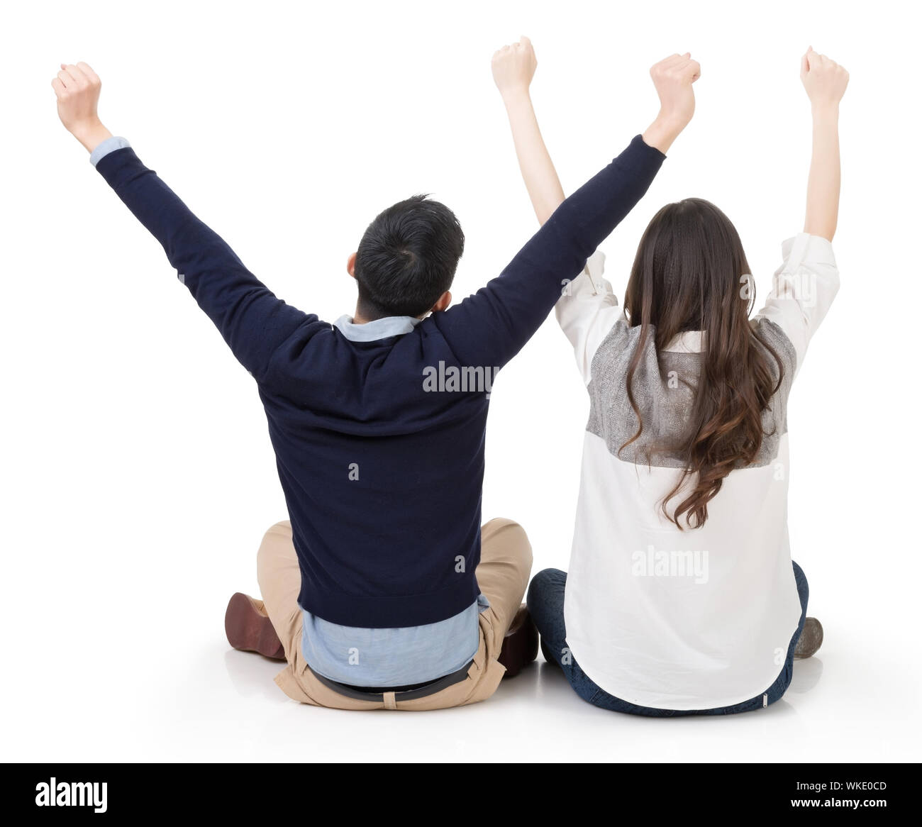 Asian couple sit on ground and open arms feel free, rear view on white ...