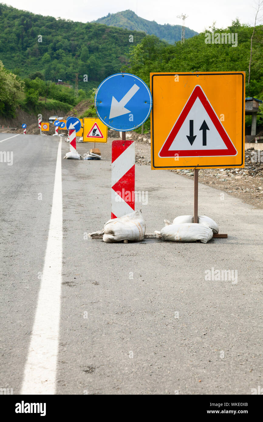Temporary road construction traffic signs on a road Stock Photo - Alamy