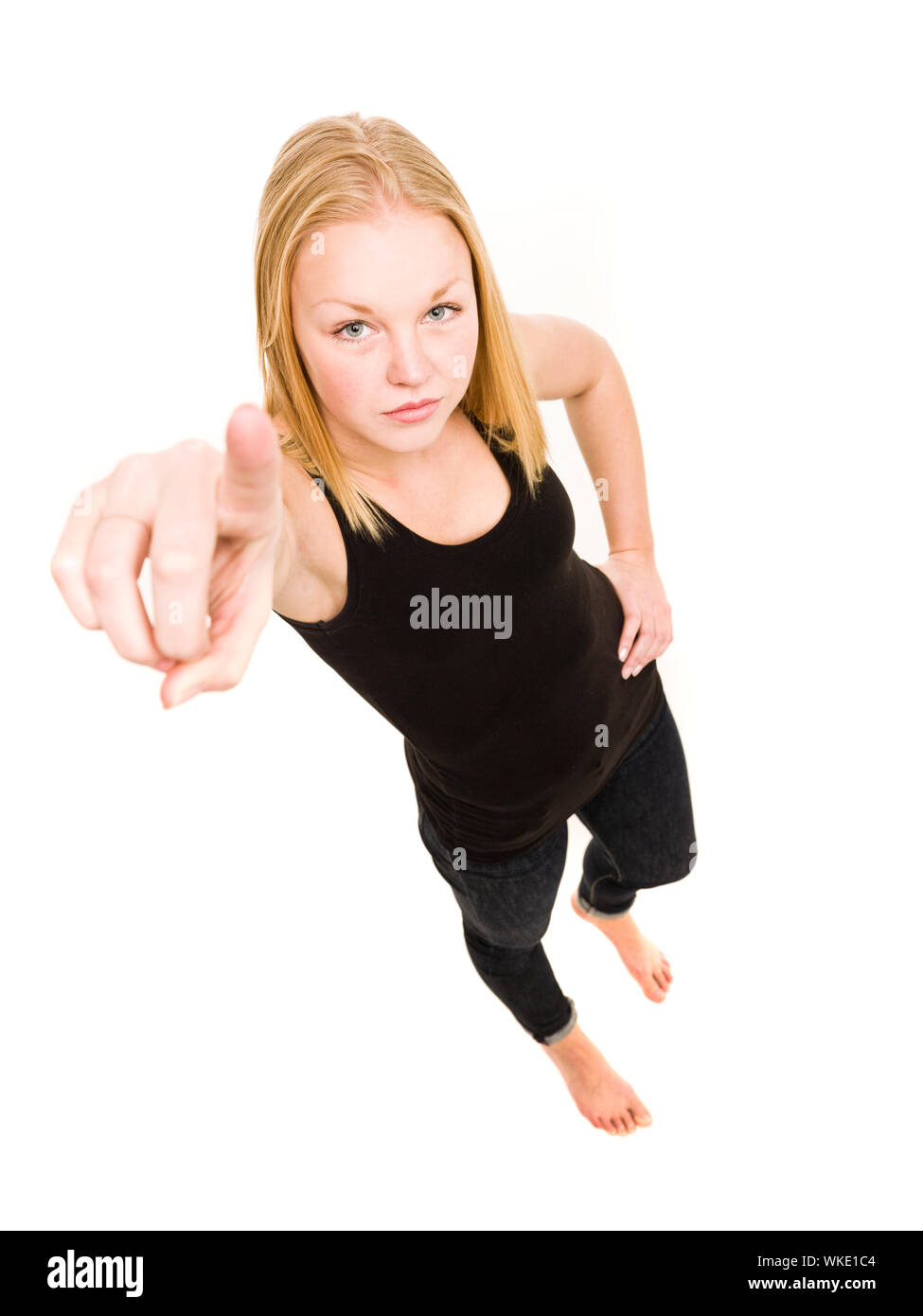 Young woman pointing isolated on white background Stock Photo - Alamy