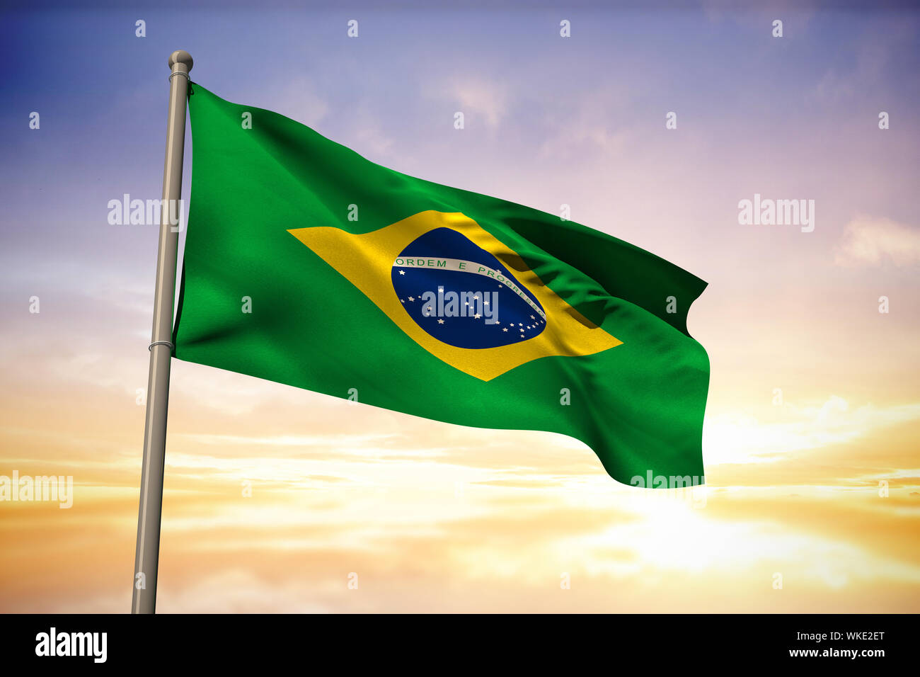 Brazil national flag against beautiful blue and yellow sky Stock Photo ...