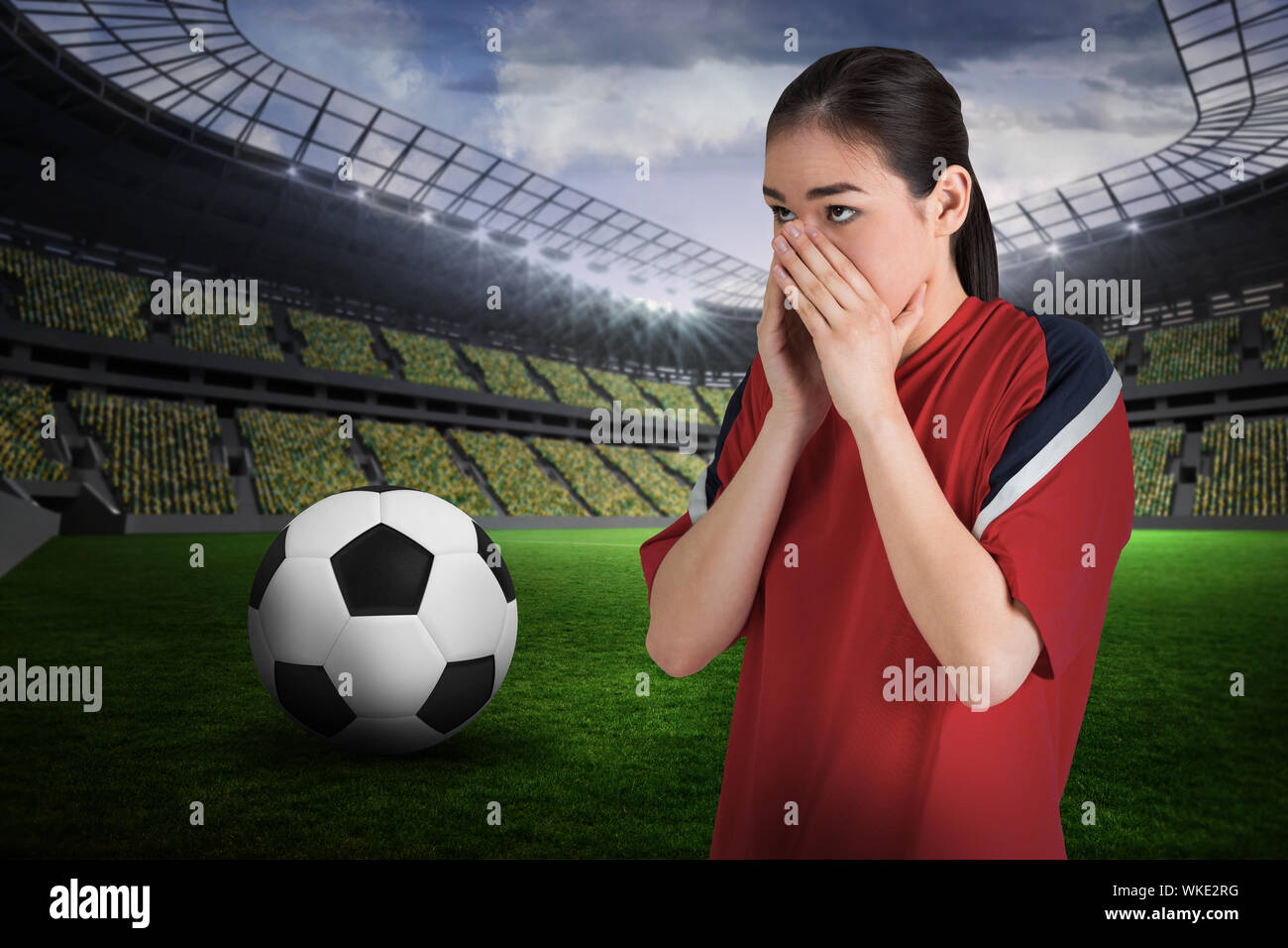 Nervous football fan looking ahead against large football stadium with ...