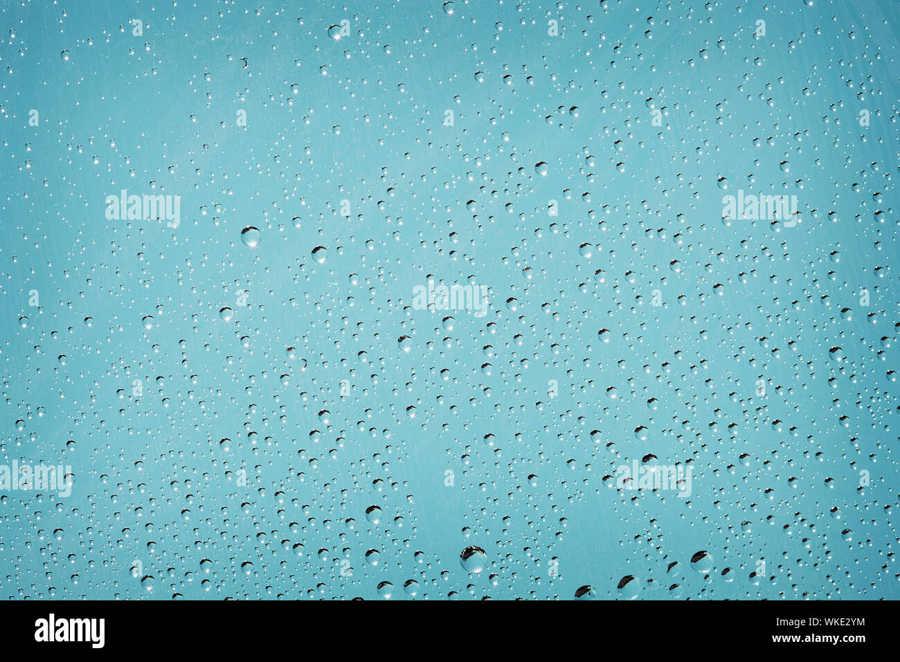 Blue background with tiny droplets of water Stock Photo - Alamy
