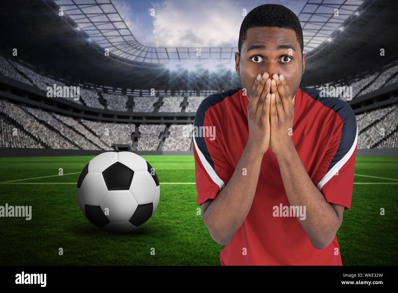 Nervous football fan looking ahead against vast football stadium with ...