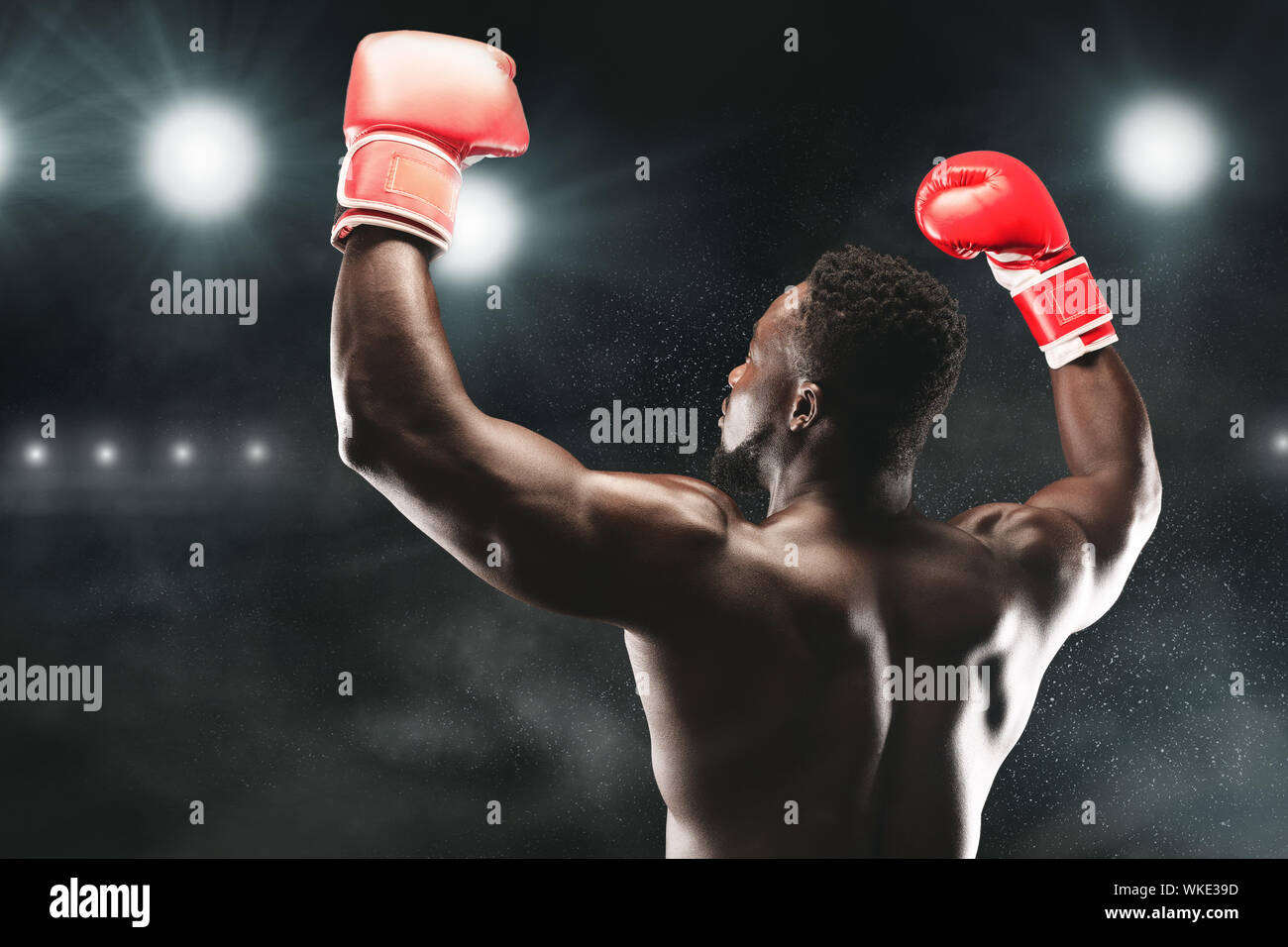 African american boxing champion raising hands up Stock Photo - Alamy